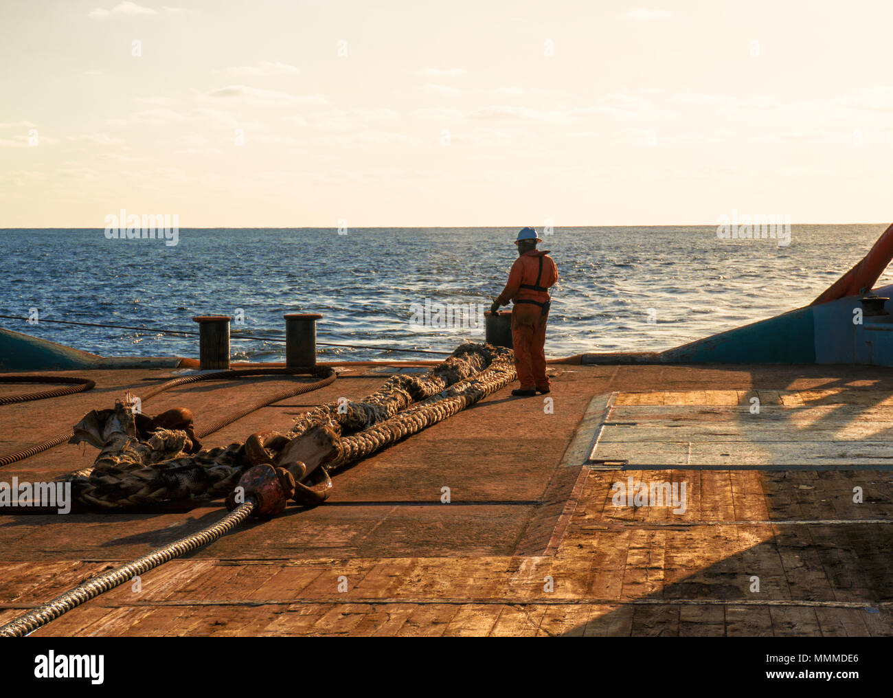 Anchor-handling Tug Supply AHTS vessel crew preparing vessel for static ...