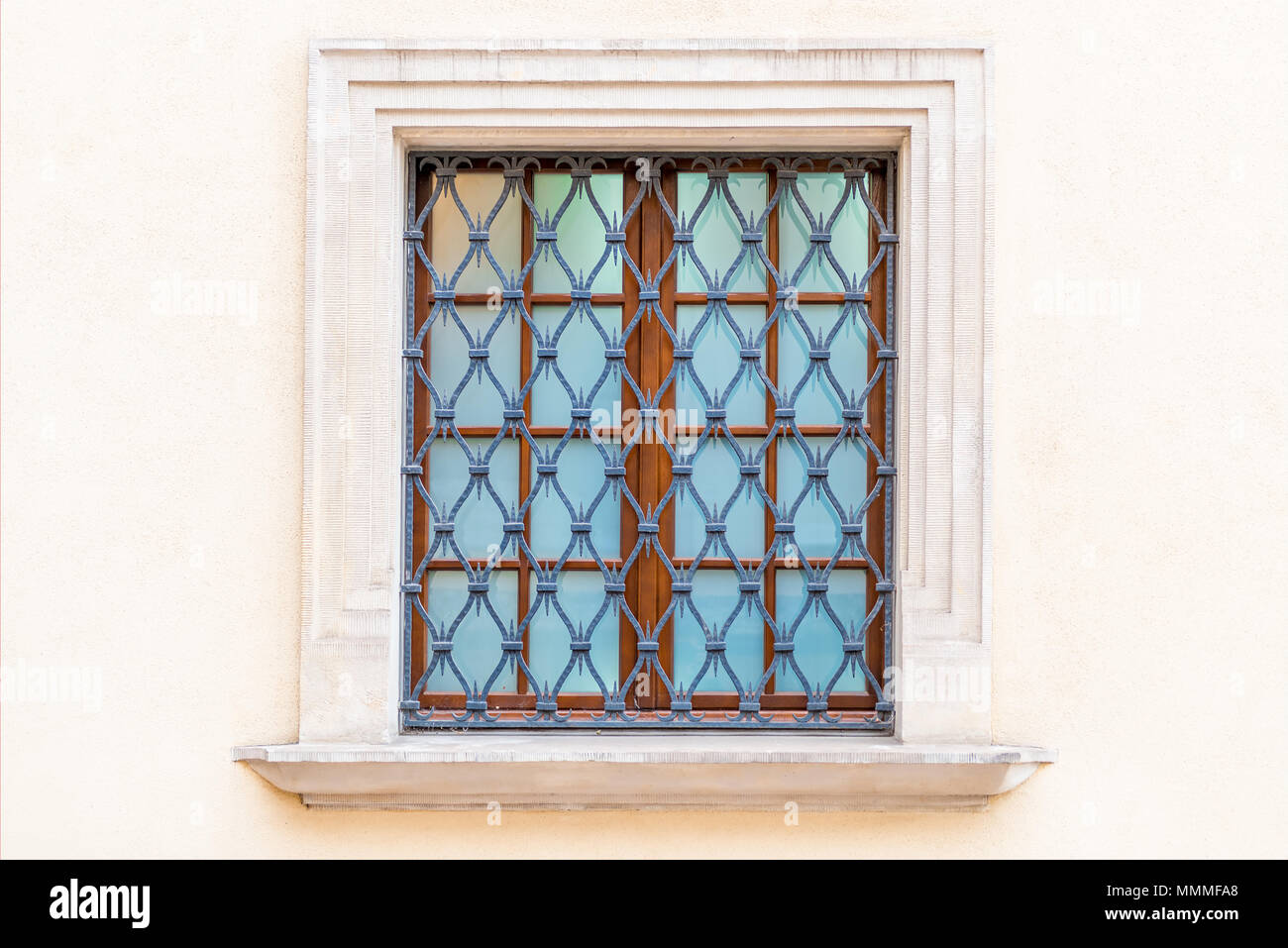 window with a medieval-style grille in the castle Stock Photo - Alamy