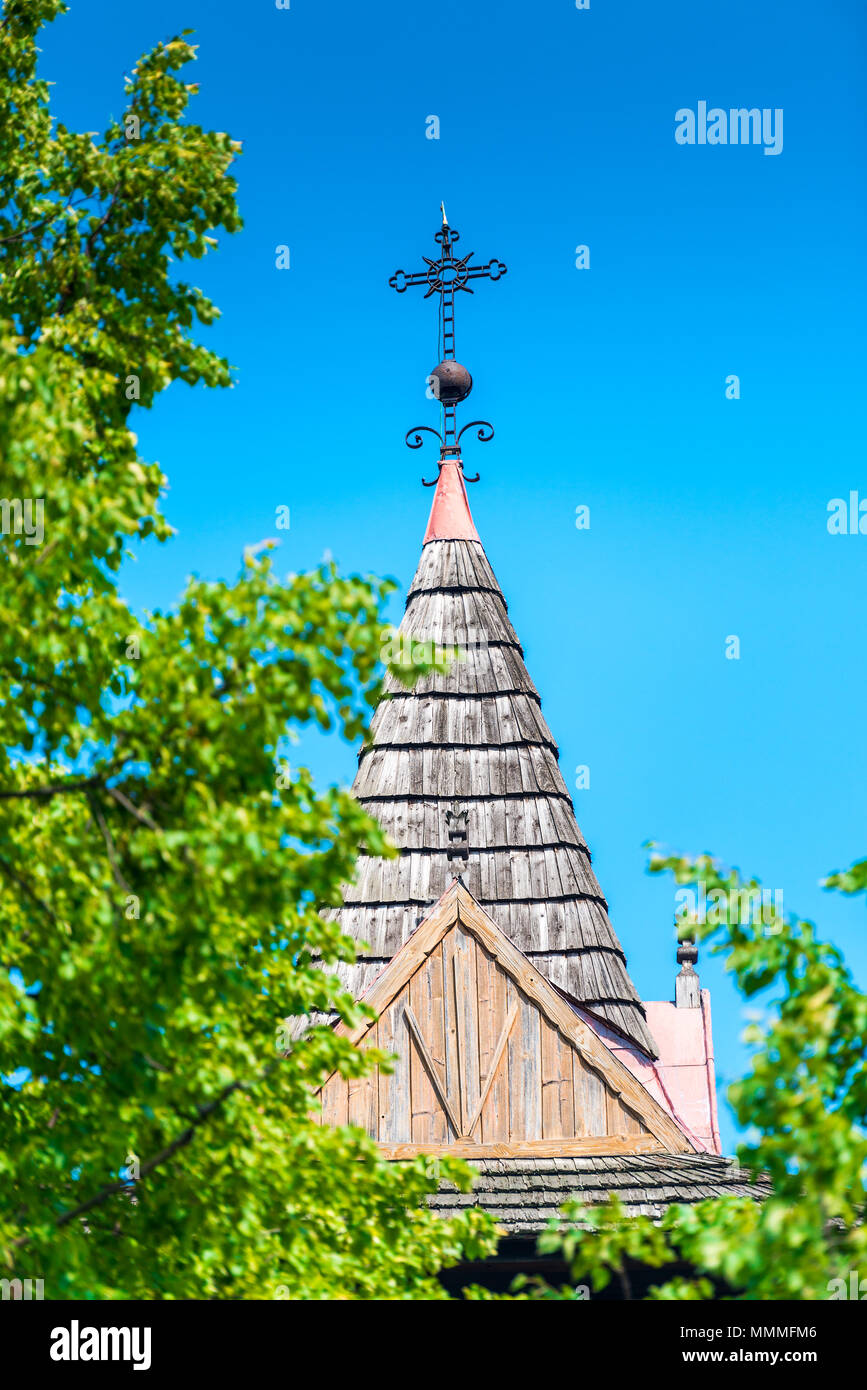 roof of a catholic wooden temple against a blue sky Stock Photo - Alamy