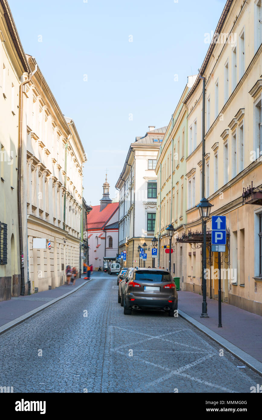 European street with parked cars near the sidewalk Stock Photo - Alamy