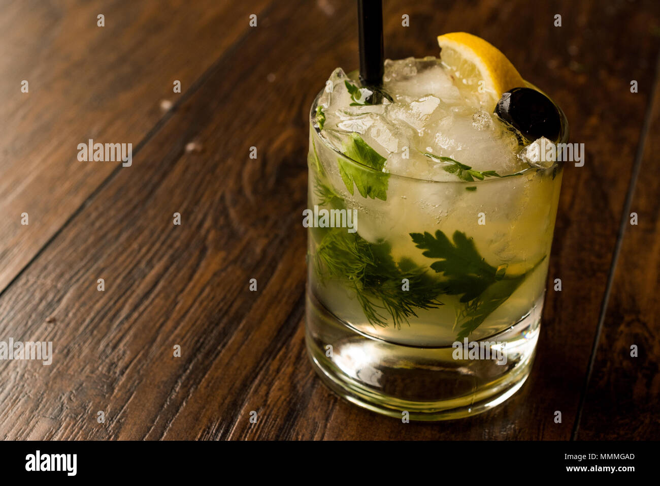 Dillionaire Cocktail with Dill, Gin, Parsley, lemon, Olive and Crushed ...