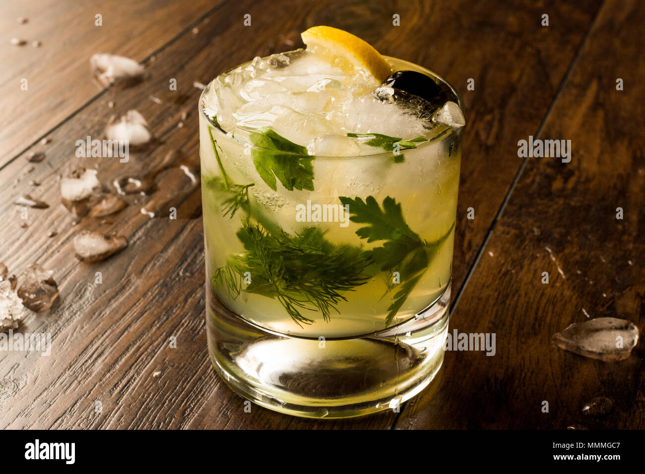 Dillionaire Cocktail with Dill, Gin, Parsley, lemon, Olive and Crushed ...