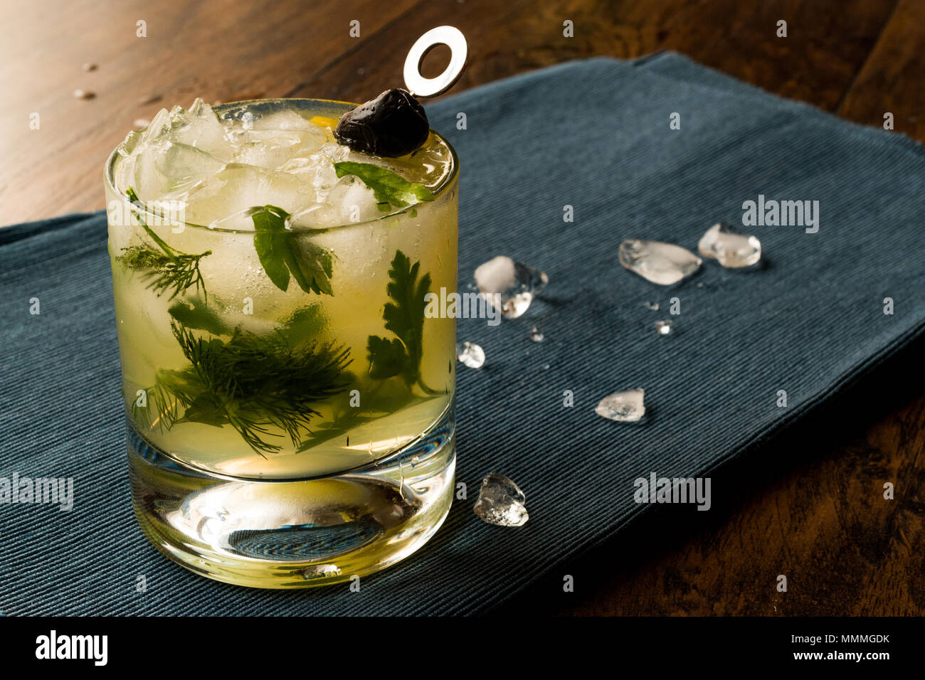 Dillionaire Cocktail with Dill, Gin, Parsley, lemon, Olive and Crushed ...