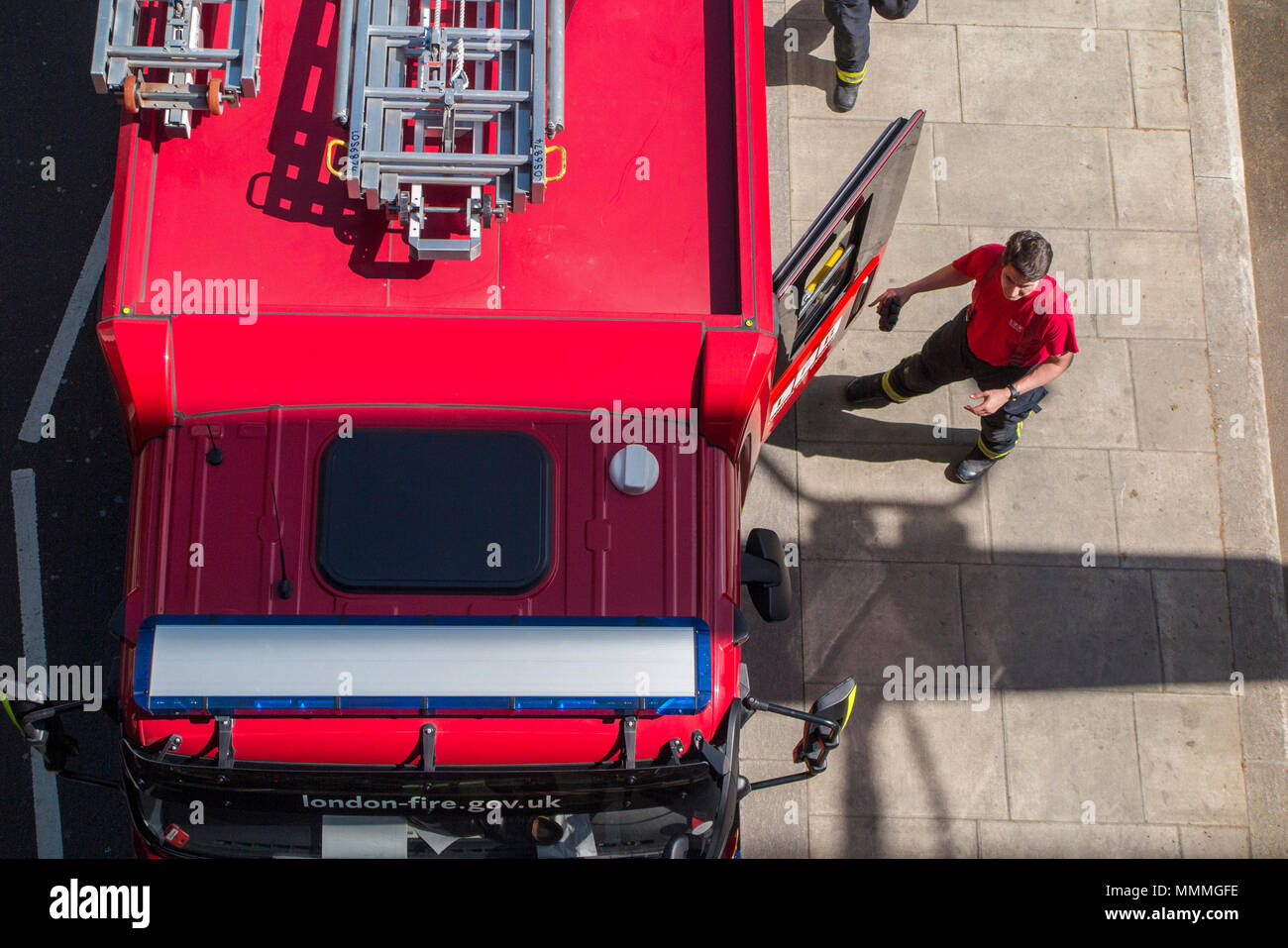 Firefighters on ladders hi-res stock photography and images - Alamy