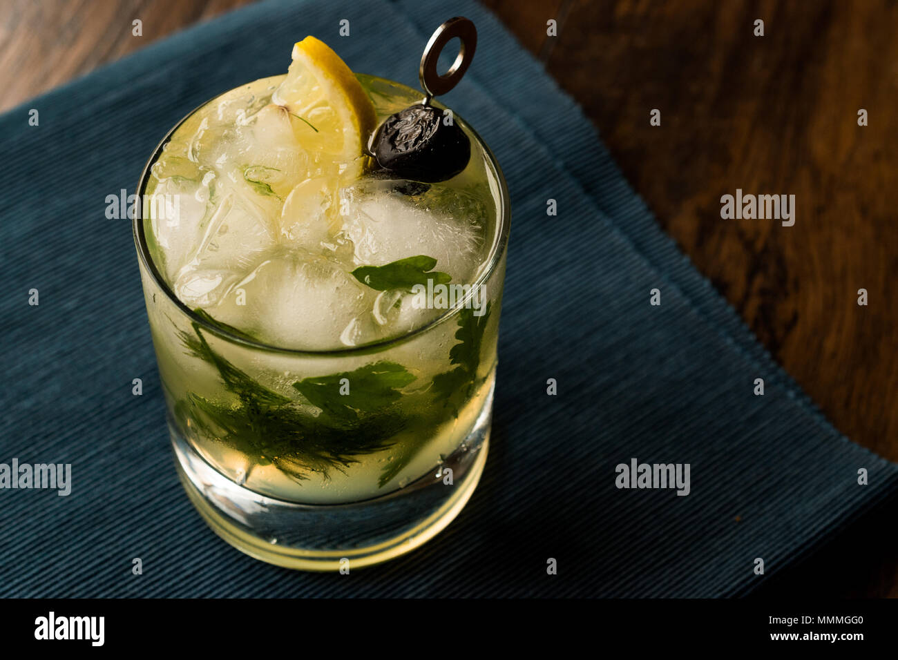 Dillionaire Cocktail with Dill, Gin, Parsley, lemon, Olive and Crushed ...