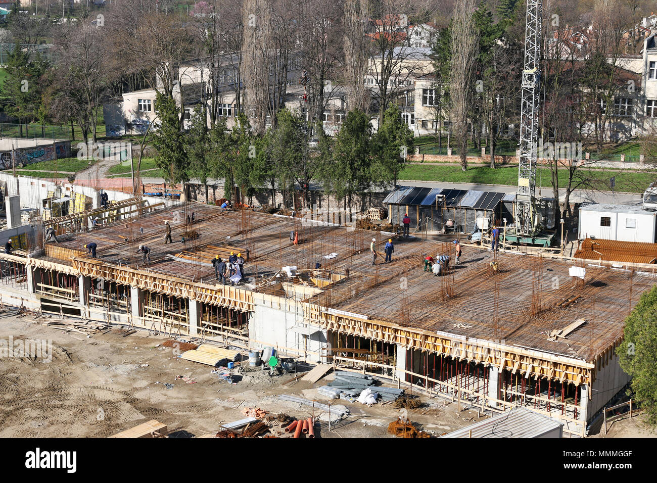 building construction site with workers Stock Photo - Alamy
