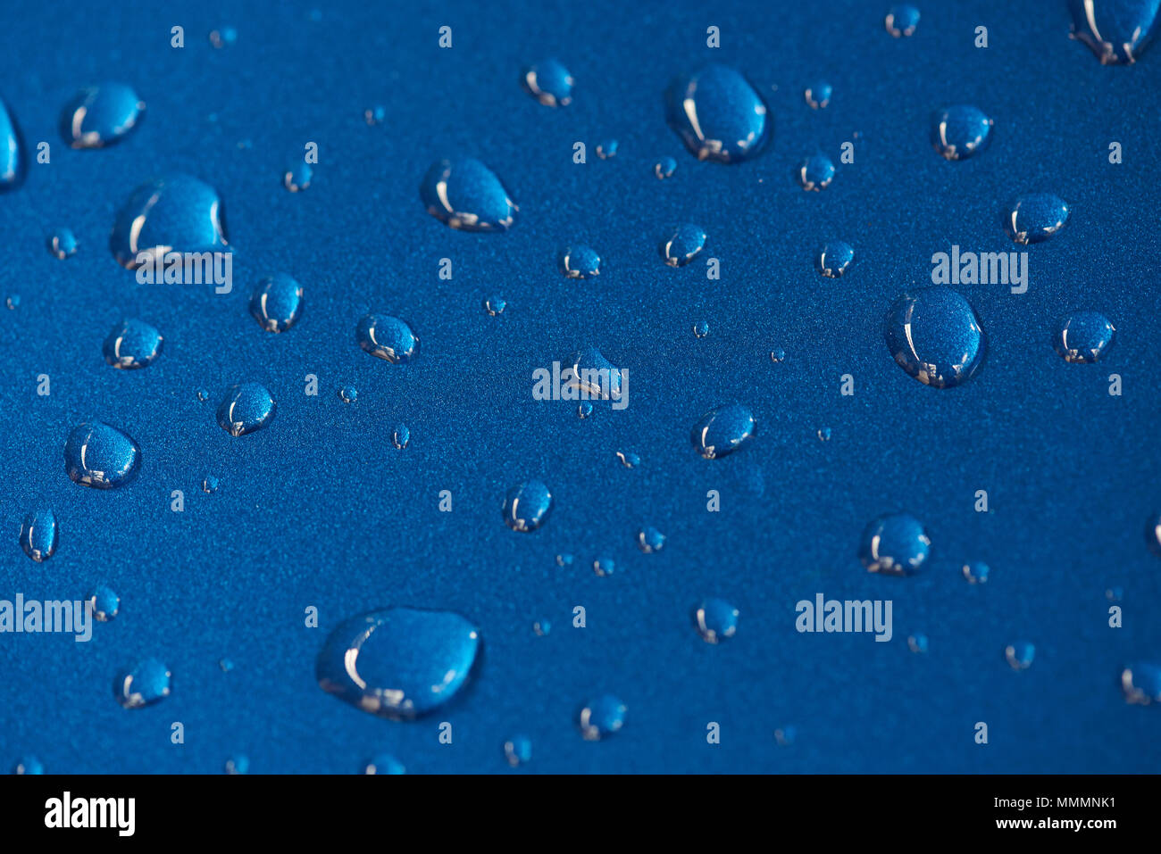 Wet blue metal surface with clear bubbles Stock Photo - Alamy