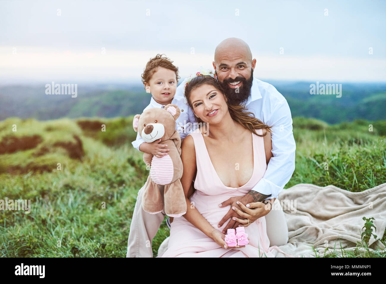 Smiling young hispanic parents waiting to borm new baby Stock Photo - Alamy