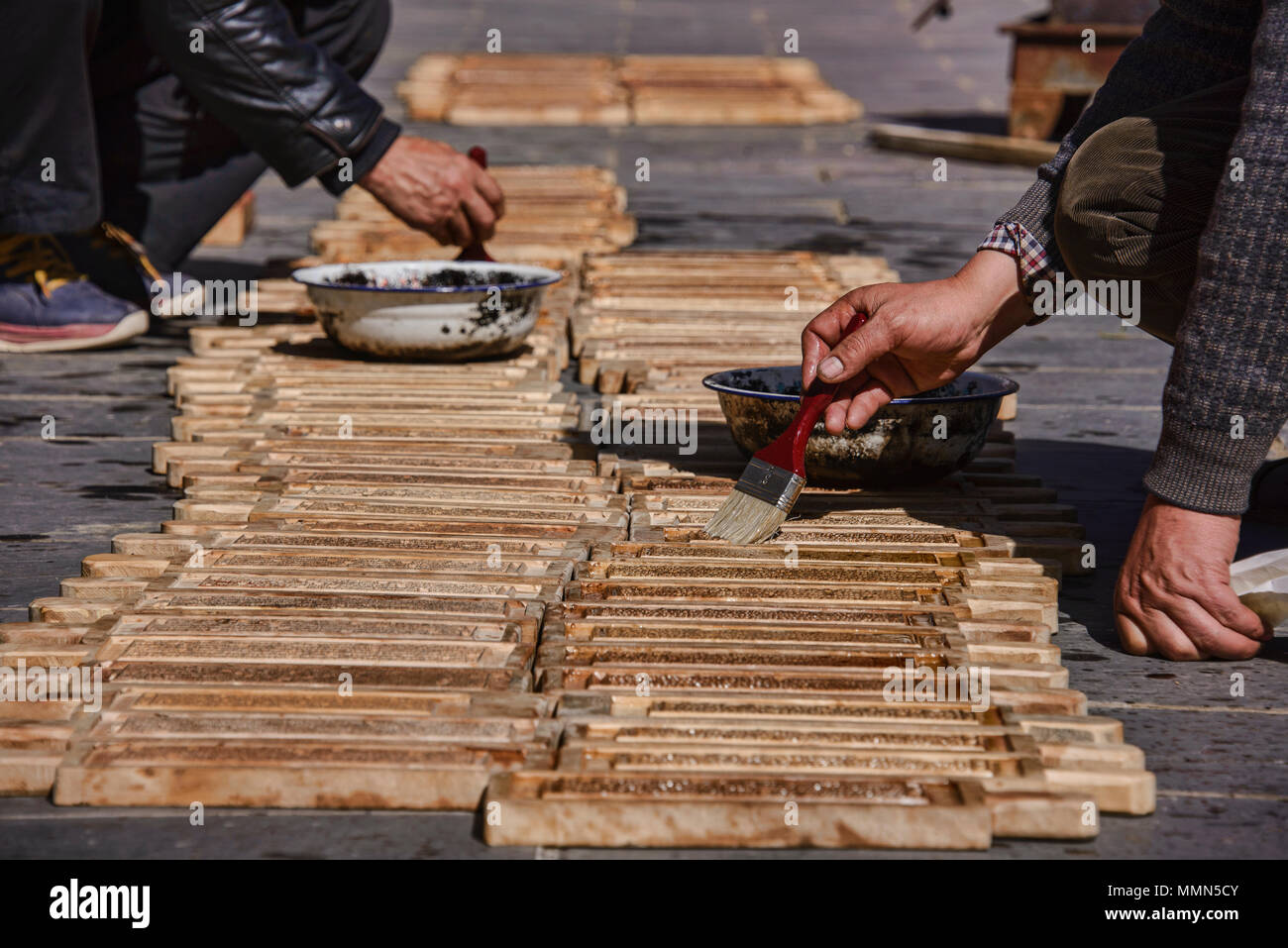 Tibetan woodblock prints at the holy Bakong Scripture Printing Press ...