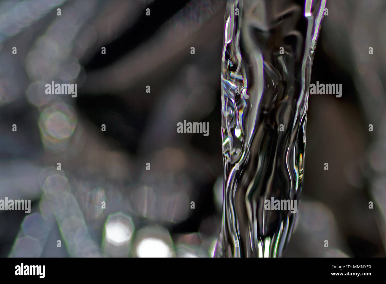 A crystal-clear stream of water flowing straight from the tap Stock ...