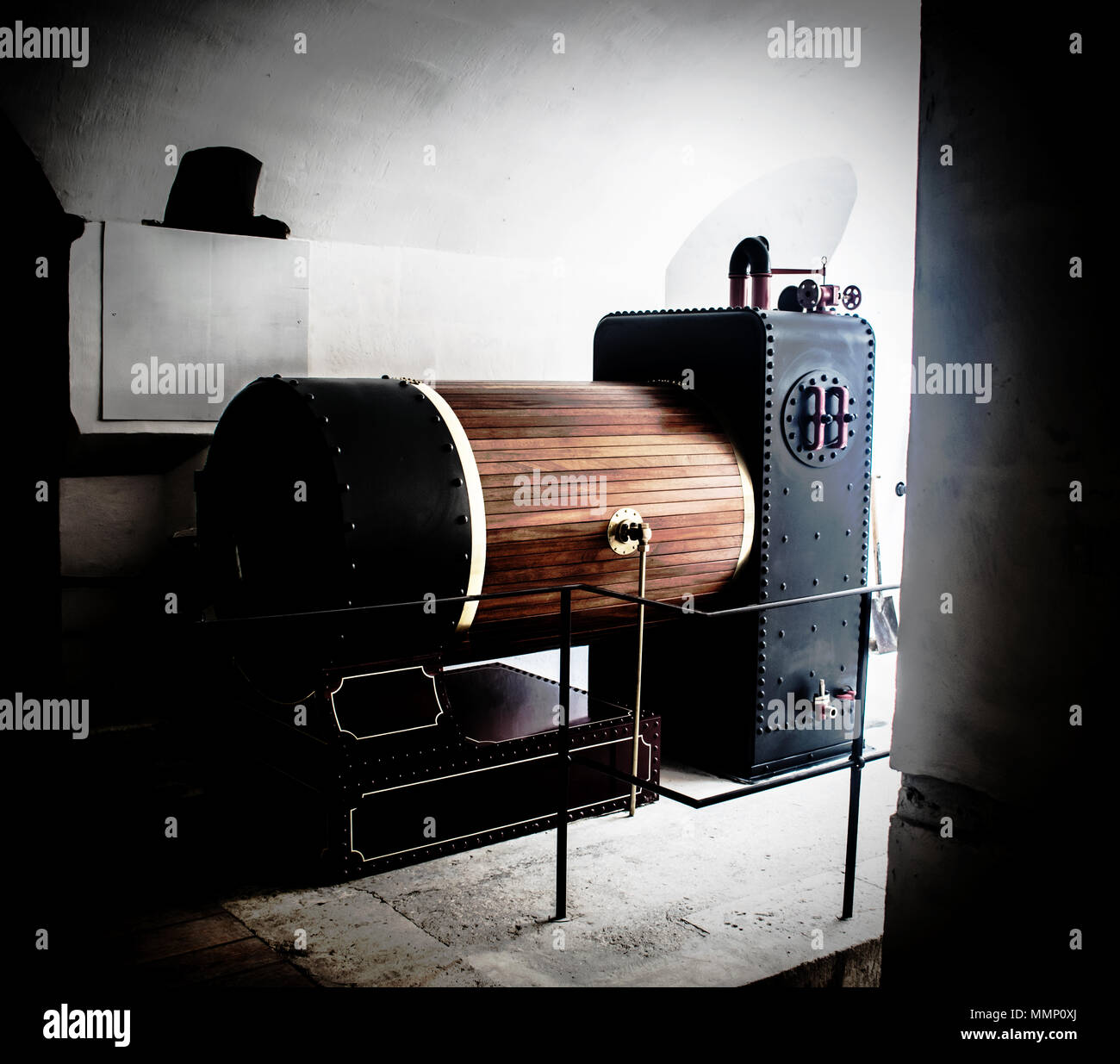 A restored old steam boiler used to create steam by applying heat ...