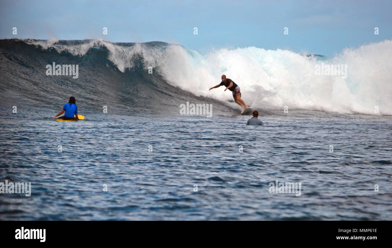 Surfers enjoying the swell at Palikir Pass or P-Pass, Pohnpei ...