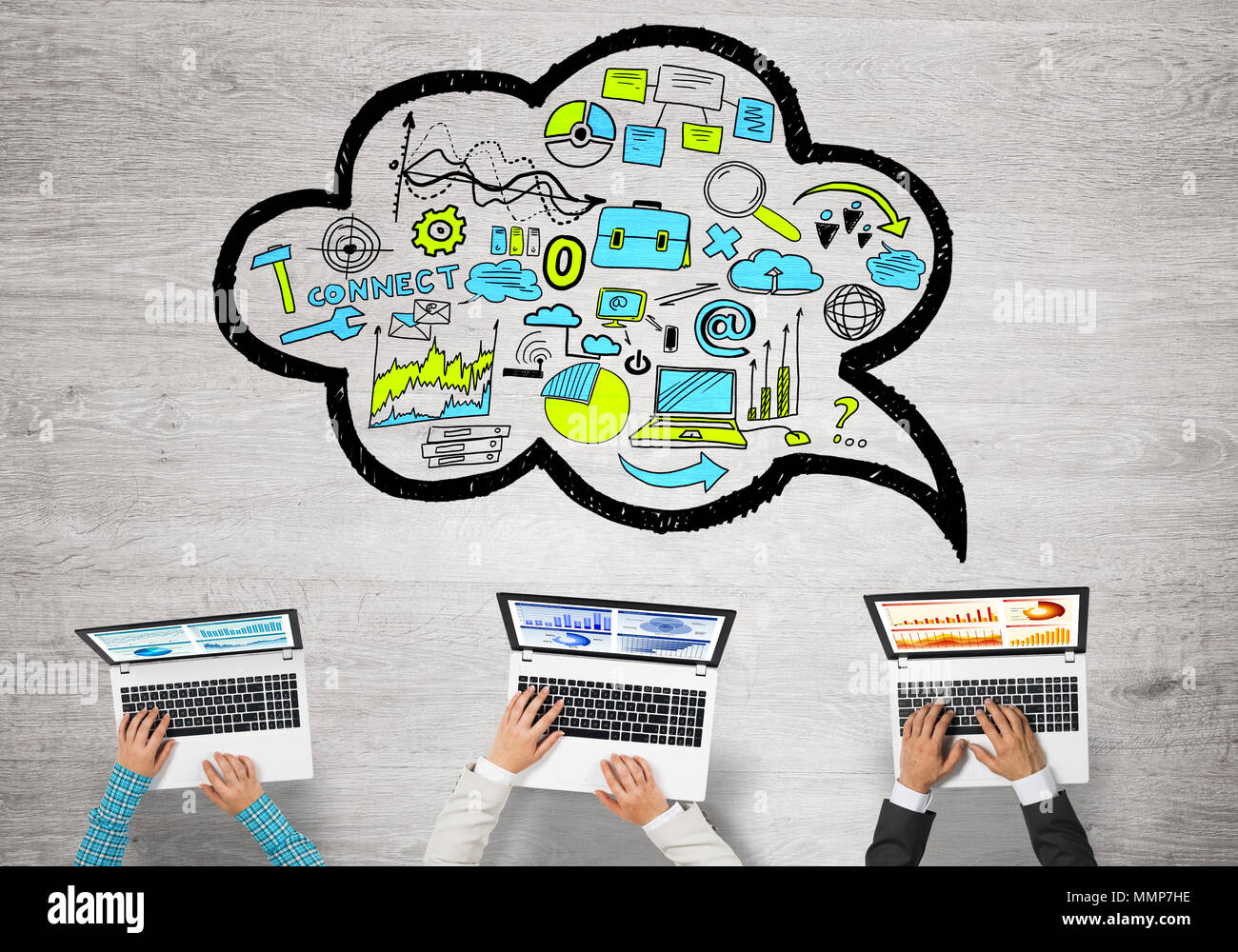 Group of people with devices in hands working together as symbol of ...