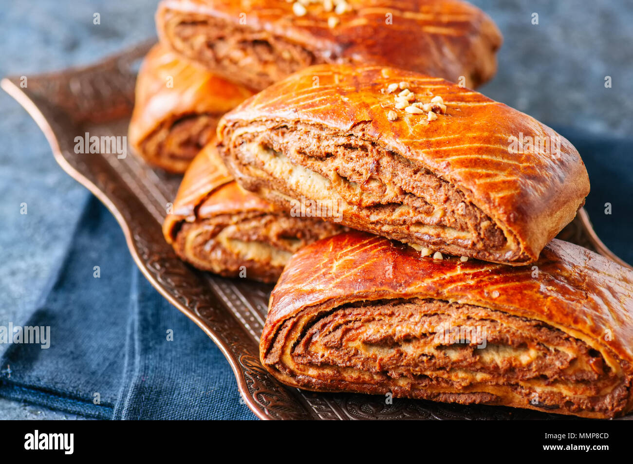 Traditional turkish pastry roll with chocolate and nuts filling ...