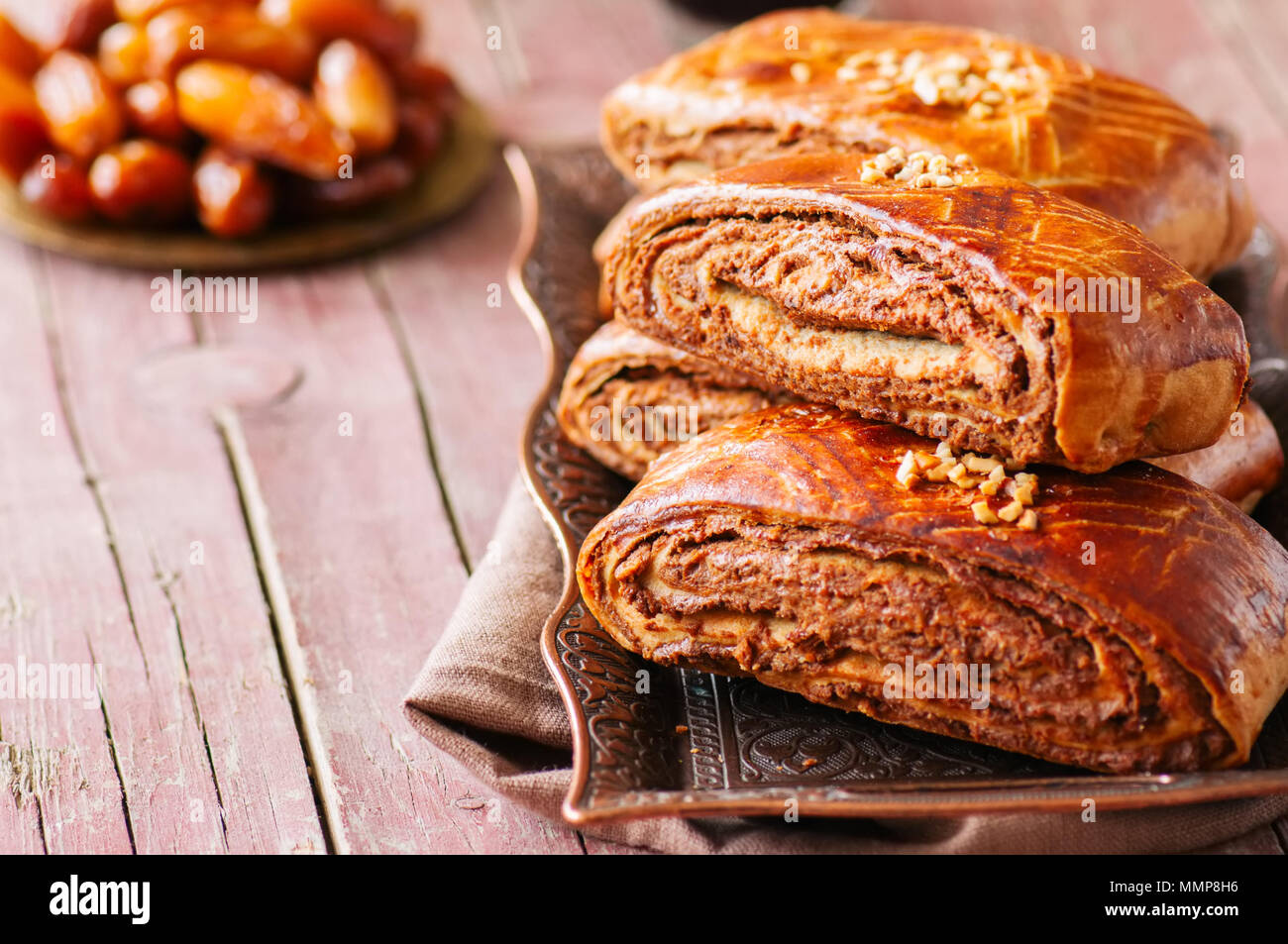Traditional turkish pastry roll with chocolate and nuts filling ...