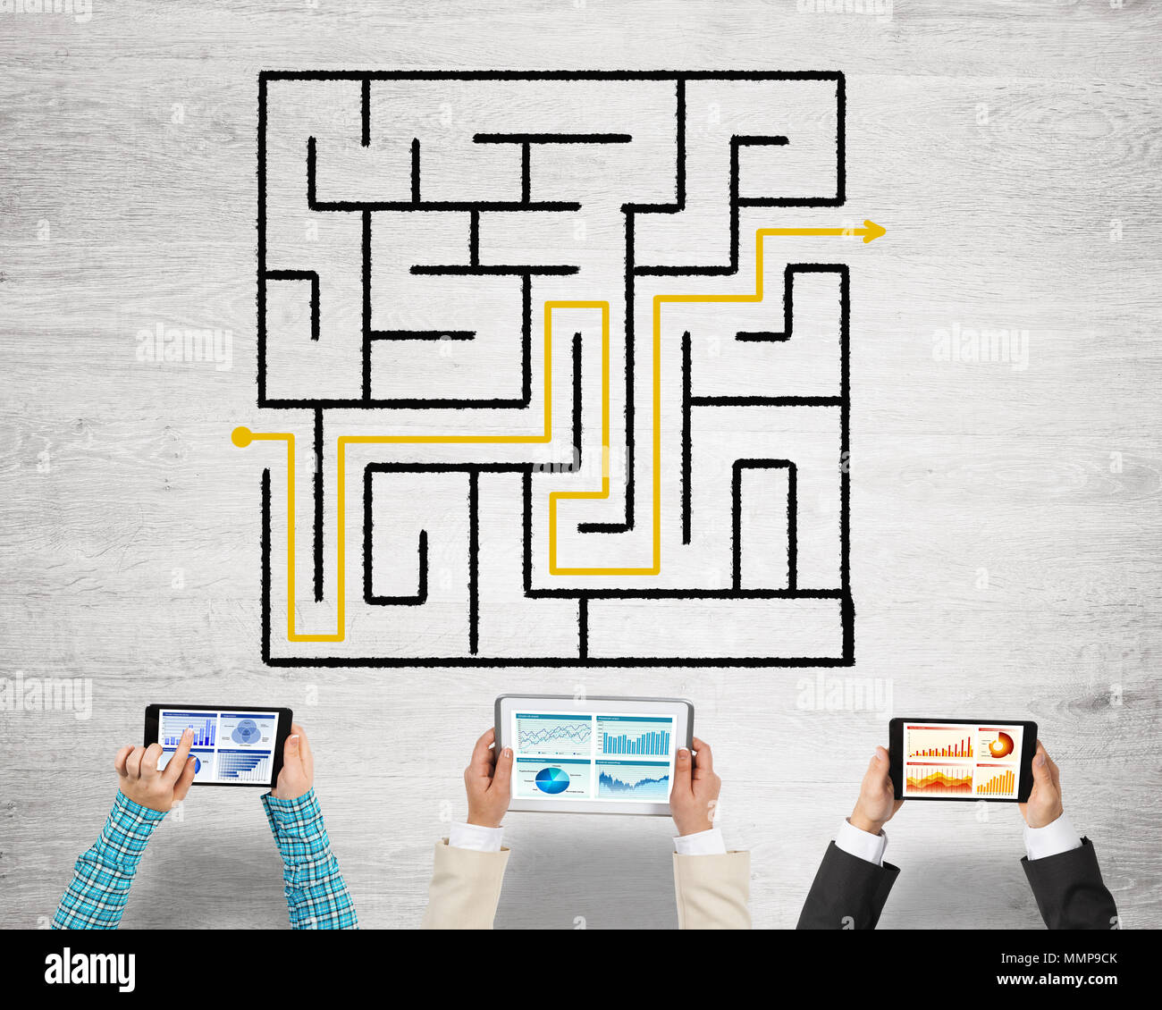 Group of people with devices in hands working together to find right ...