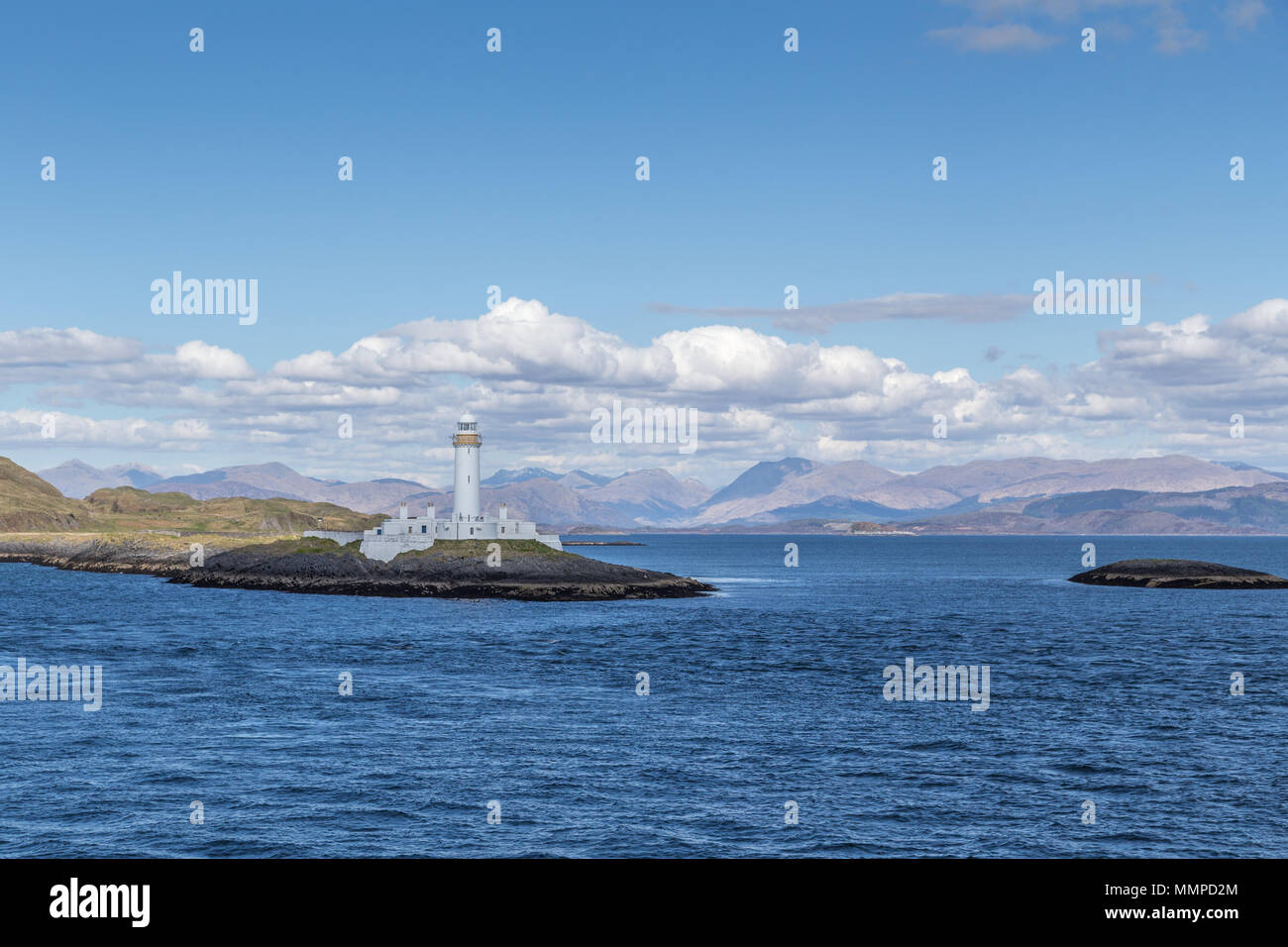 Eilean Musdile Lighthouse between Oban and the Isle of Mull in Western ...