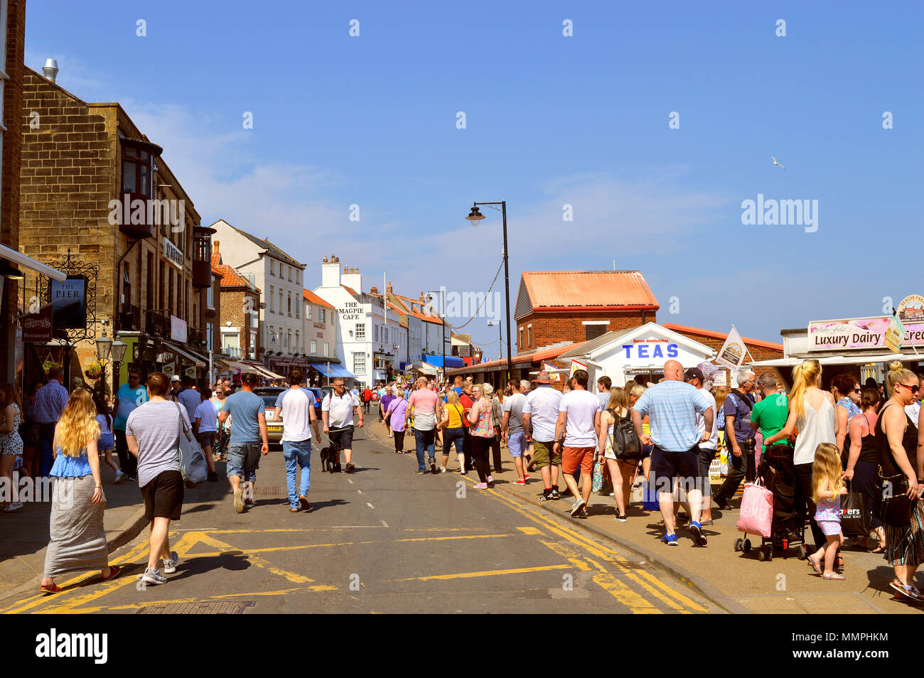 Tourists visiting Whitby a seaside town in North Yorkshire Stock Photo ...