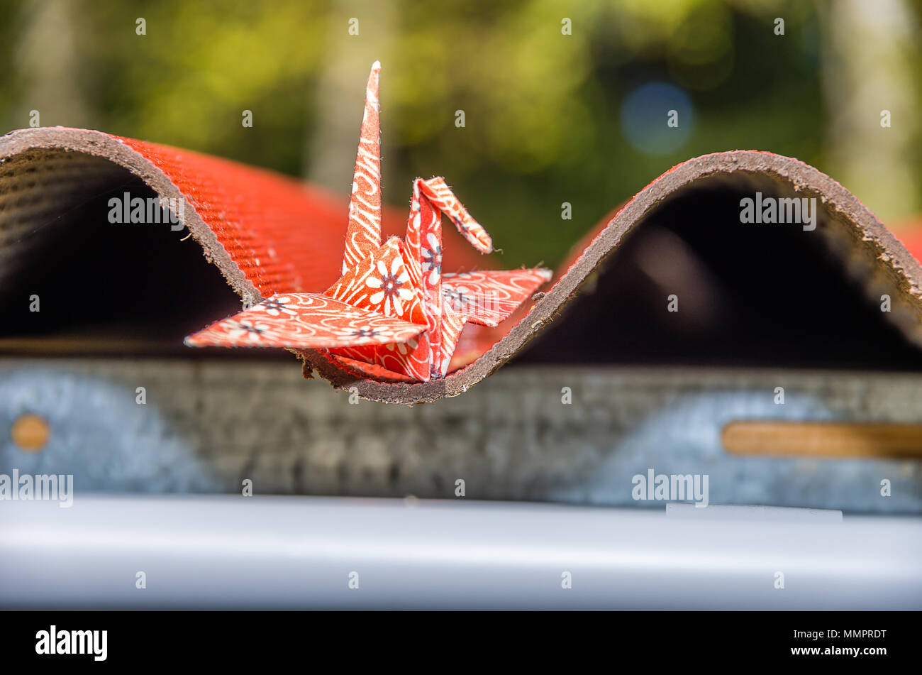 Origami paper crane made of original Japanese origami paper set up in a ...