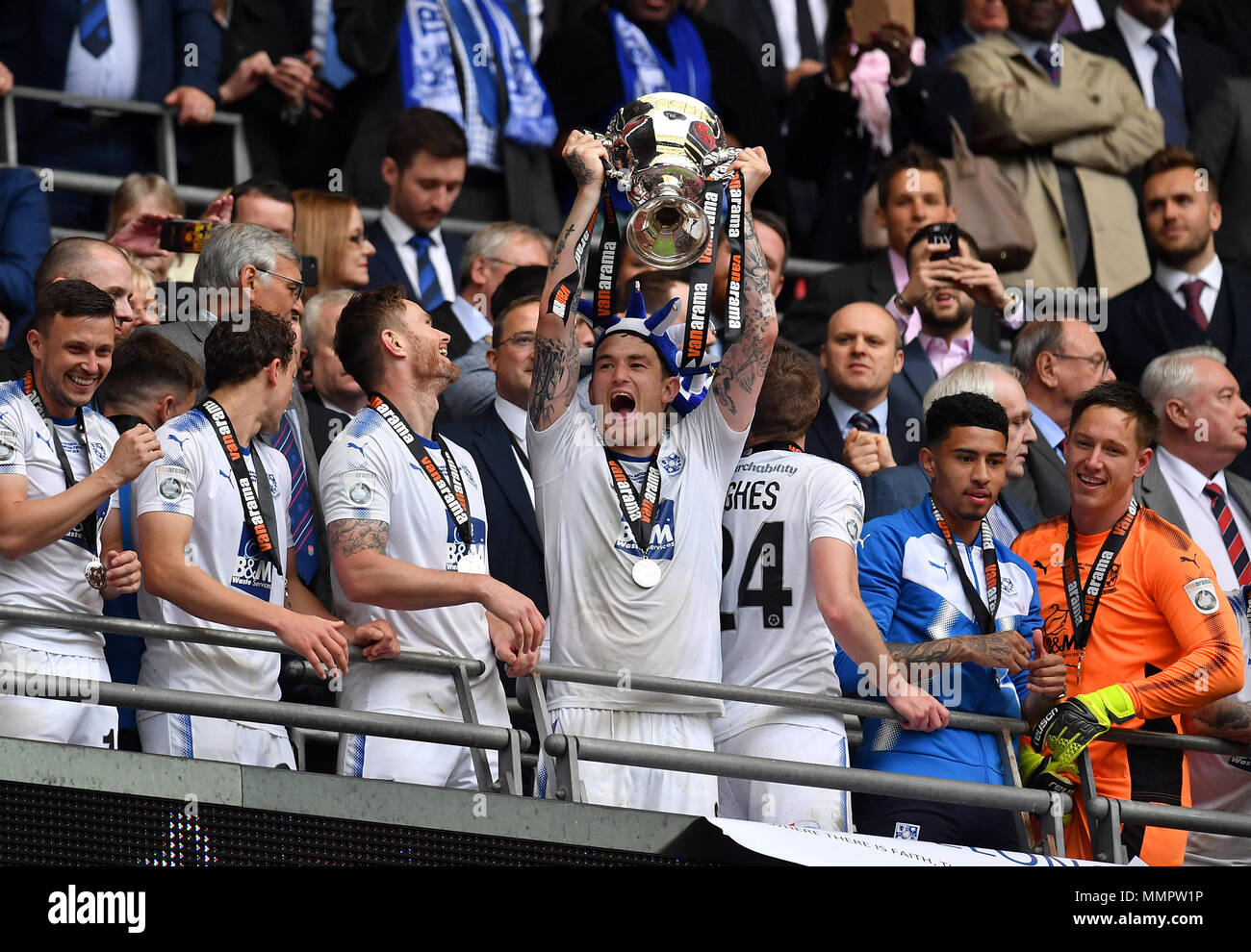 Tranmere Rovers' Andy Cook lifts the trophy after the game during the ...