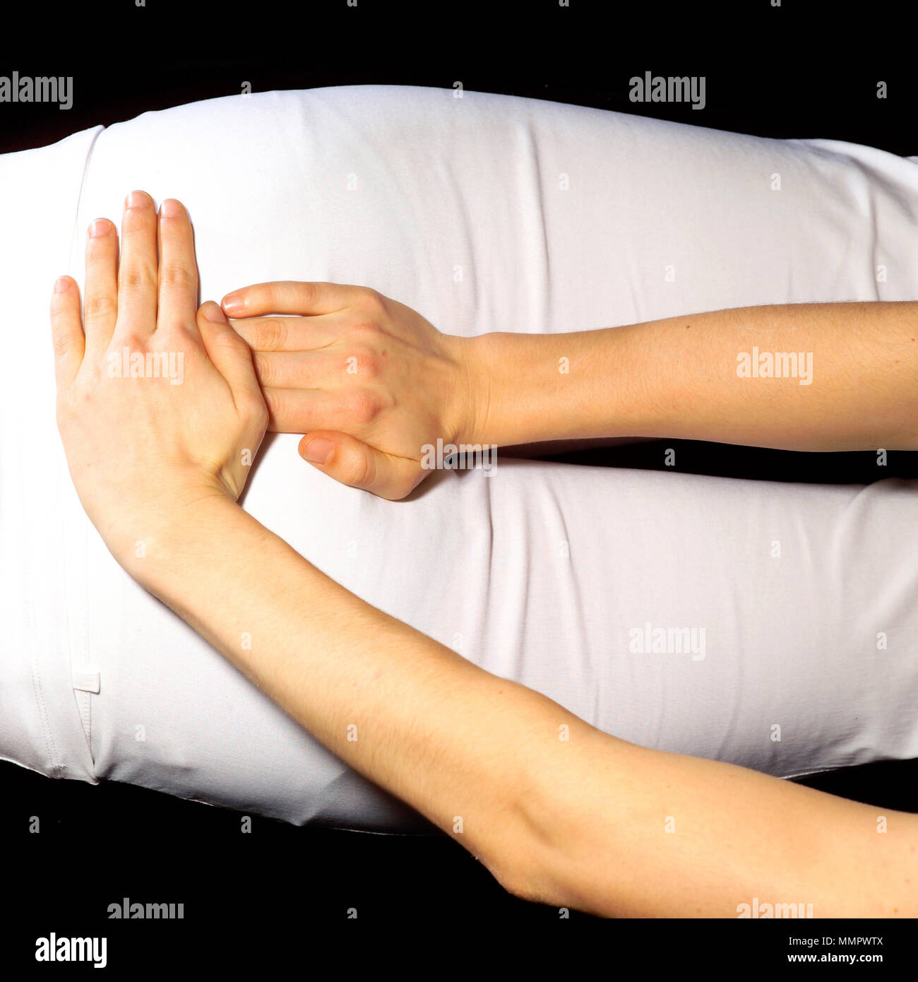 Reiki therapy of a woman in a white shirt and black background, healing hands Stock Photo - Alamy