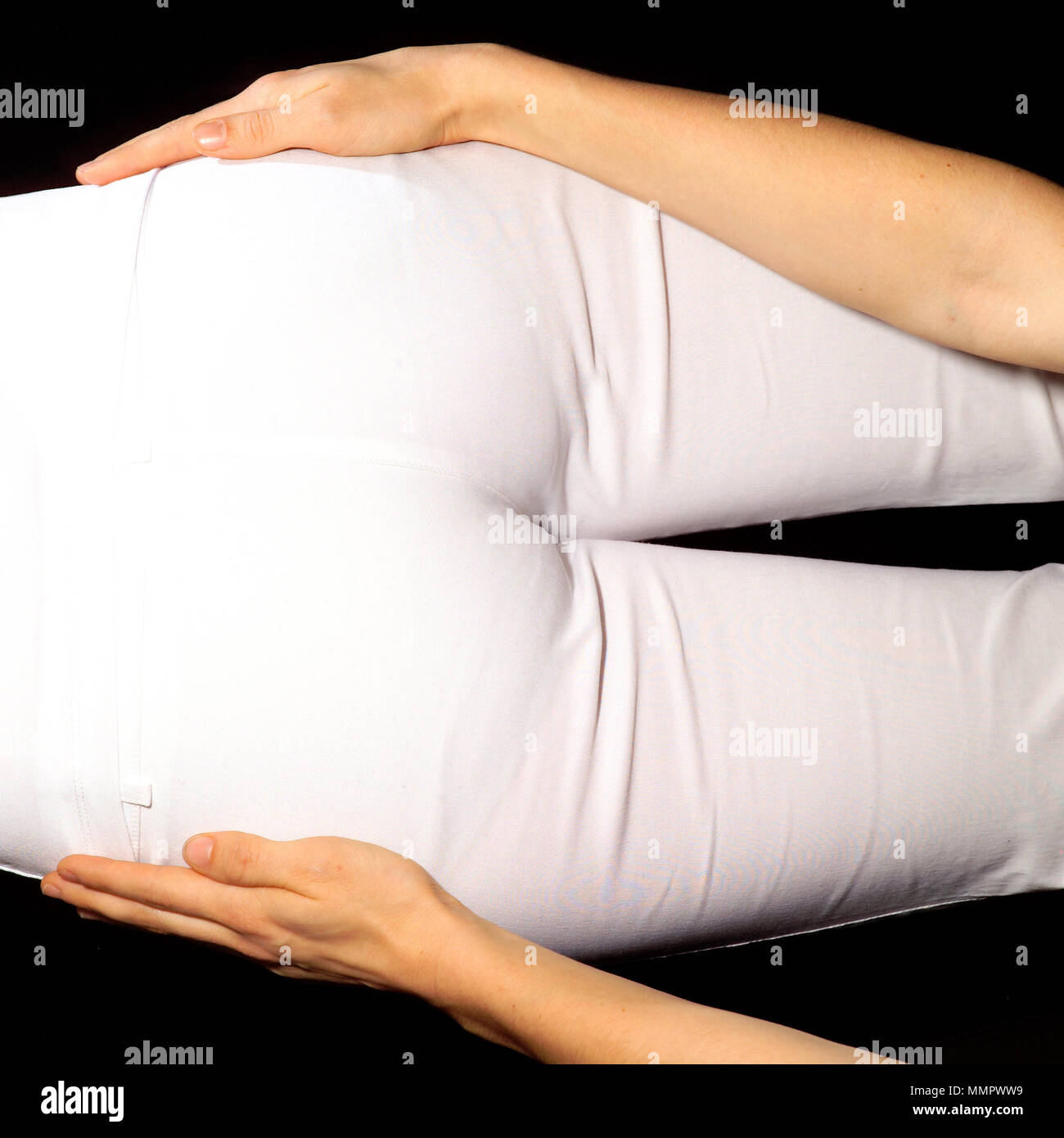 Reiki therapy of a woman in a white shirt and black background, healing hands Stock Photo - Alamy