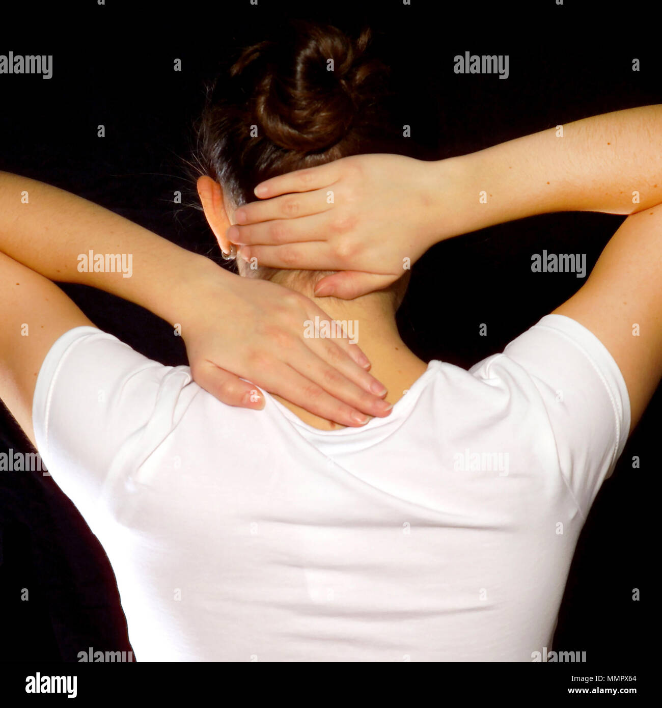Reiki therapy of a woman in a white shirt and black background, healing hands Stock Photo - Alamy