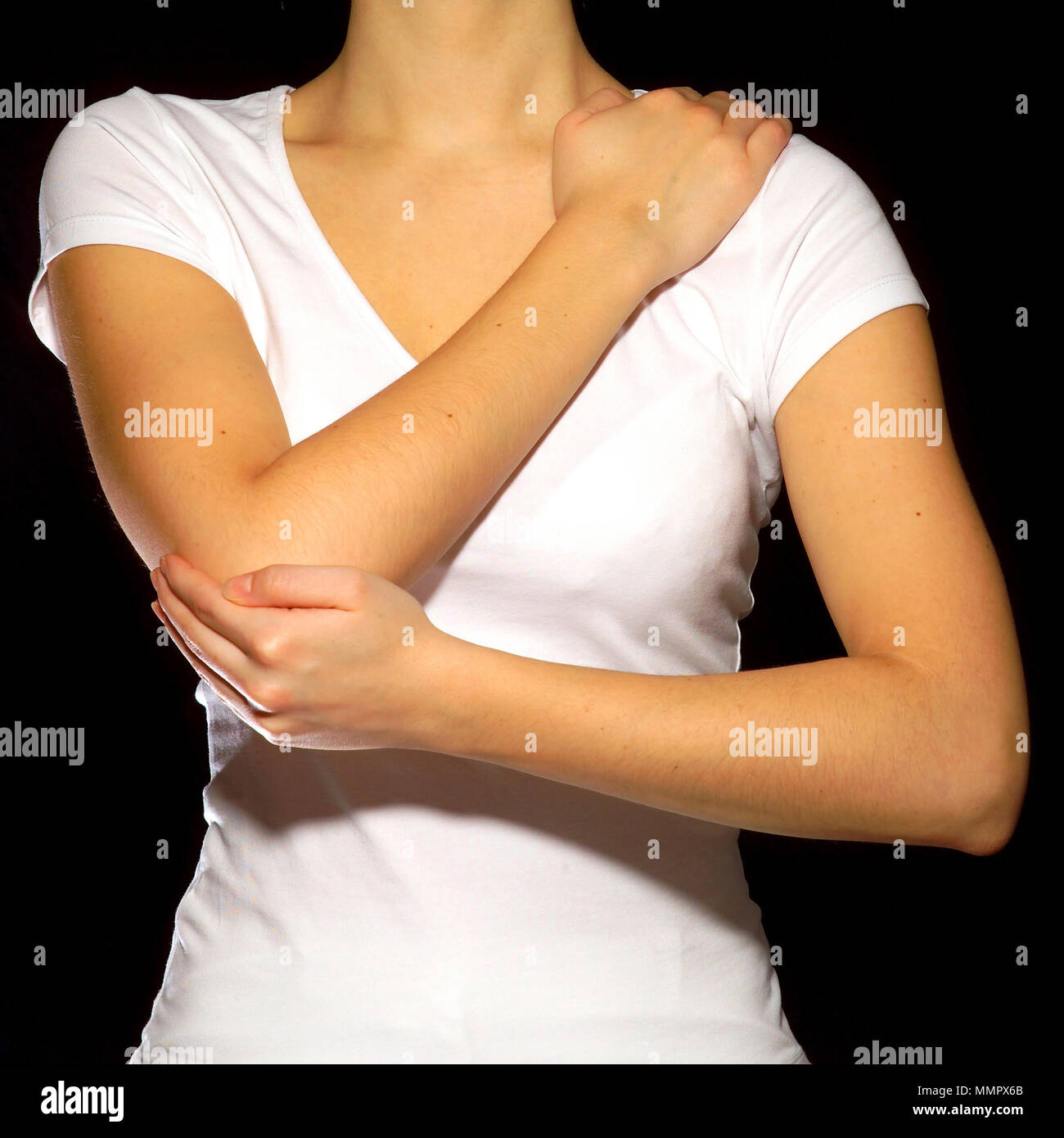 Reiki therapy of a woman in a white shirt and black background, healing hands Stock Photo - Alamy
