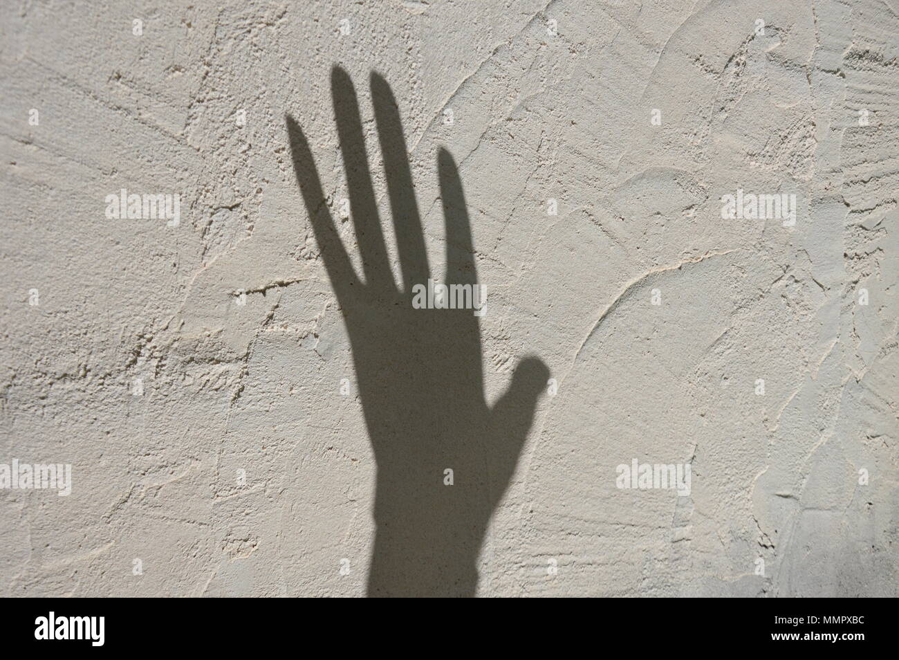 Hand shadow on wall hi-res stock photography and images - Alamy