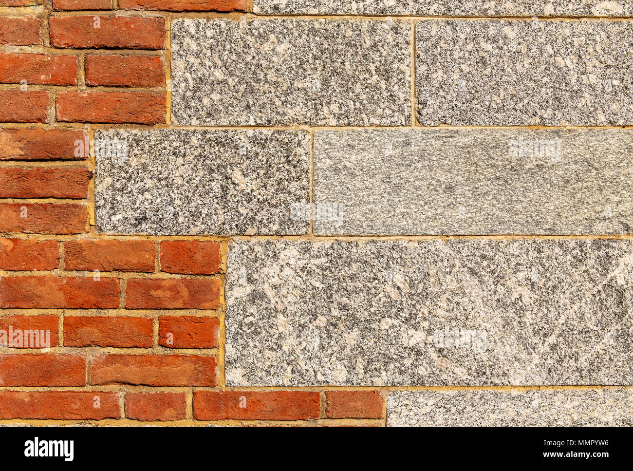 Granite and red brick wall Stock Photo - Alamy