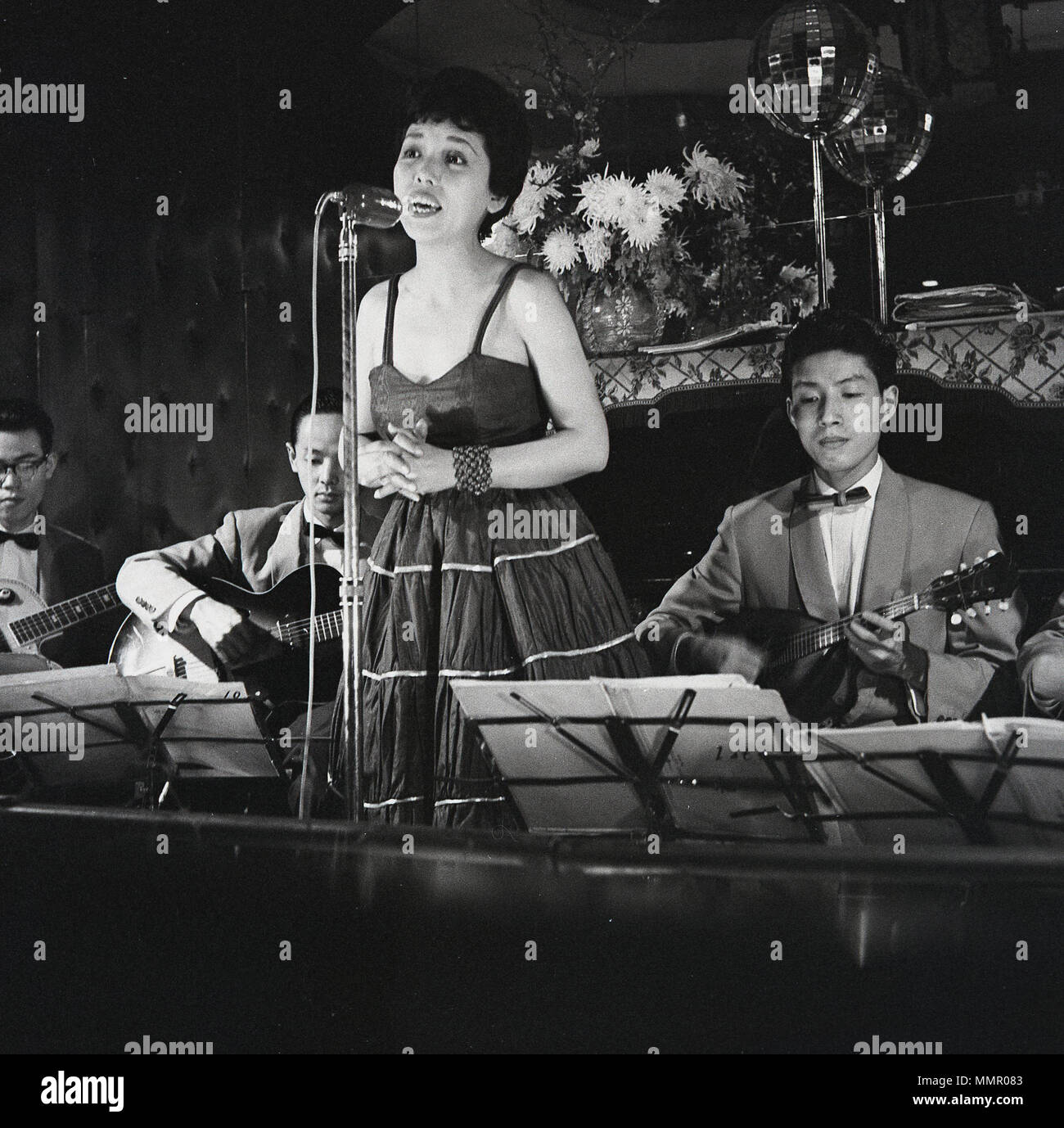 1950s, female japanese singer with band performing at a Tokyo nightclub ...