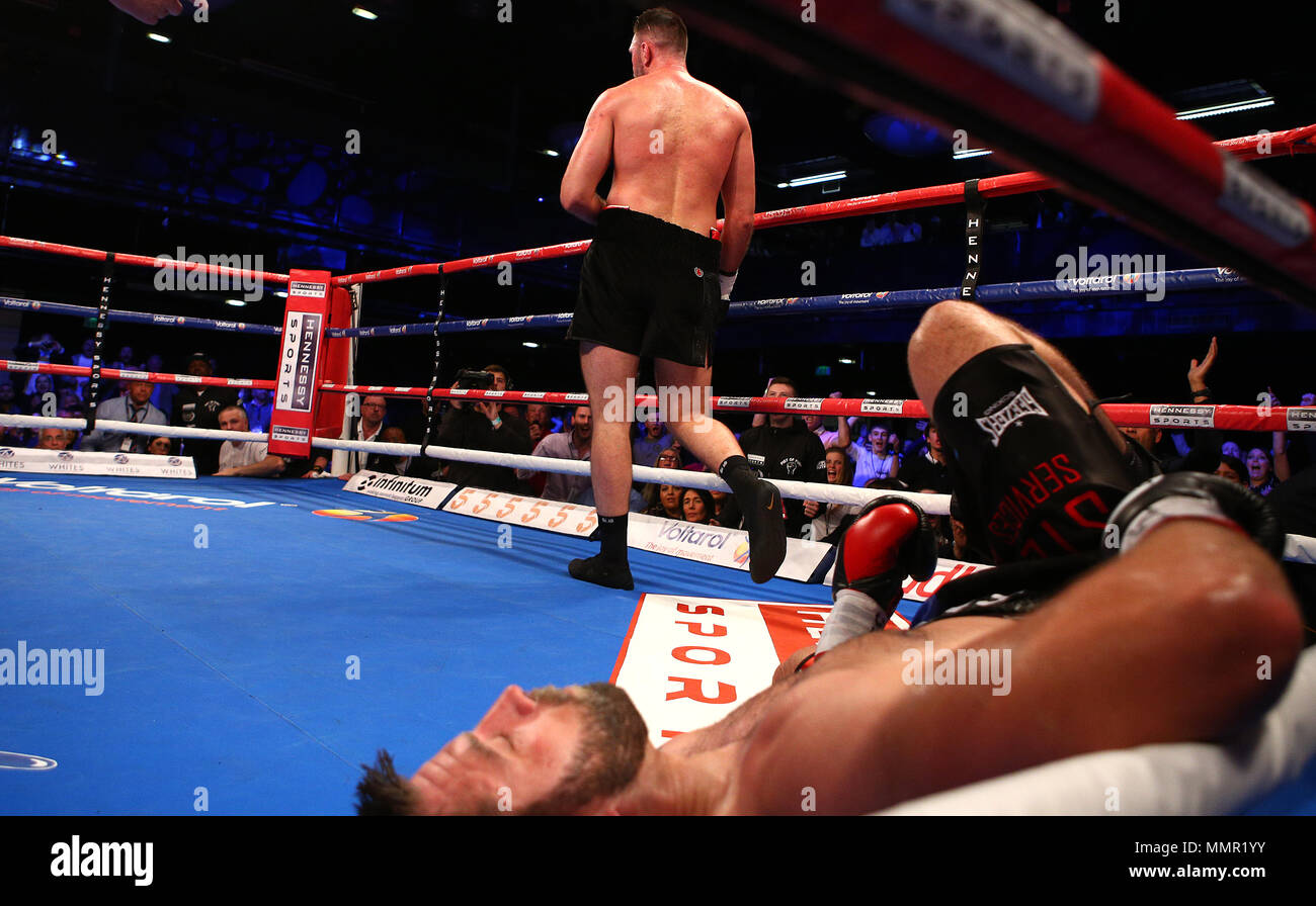 Sam Sexton (centre) on the floor during the Heavyweight title contest ...