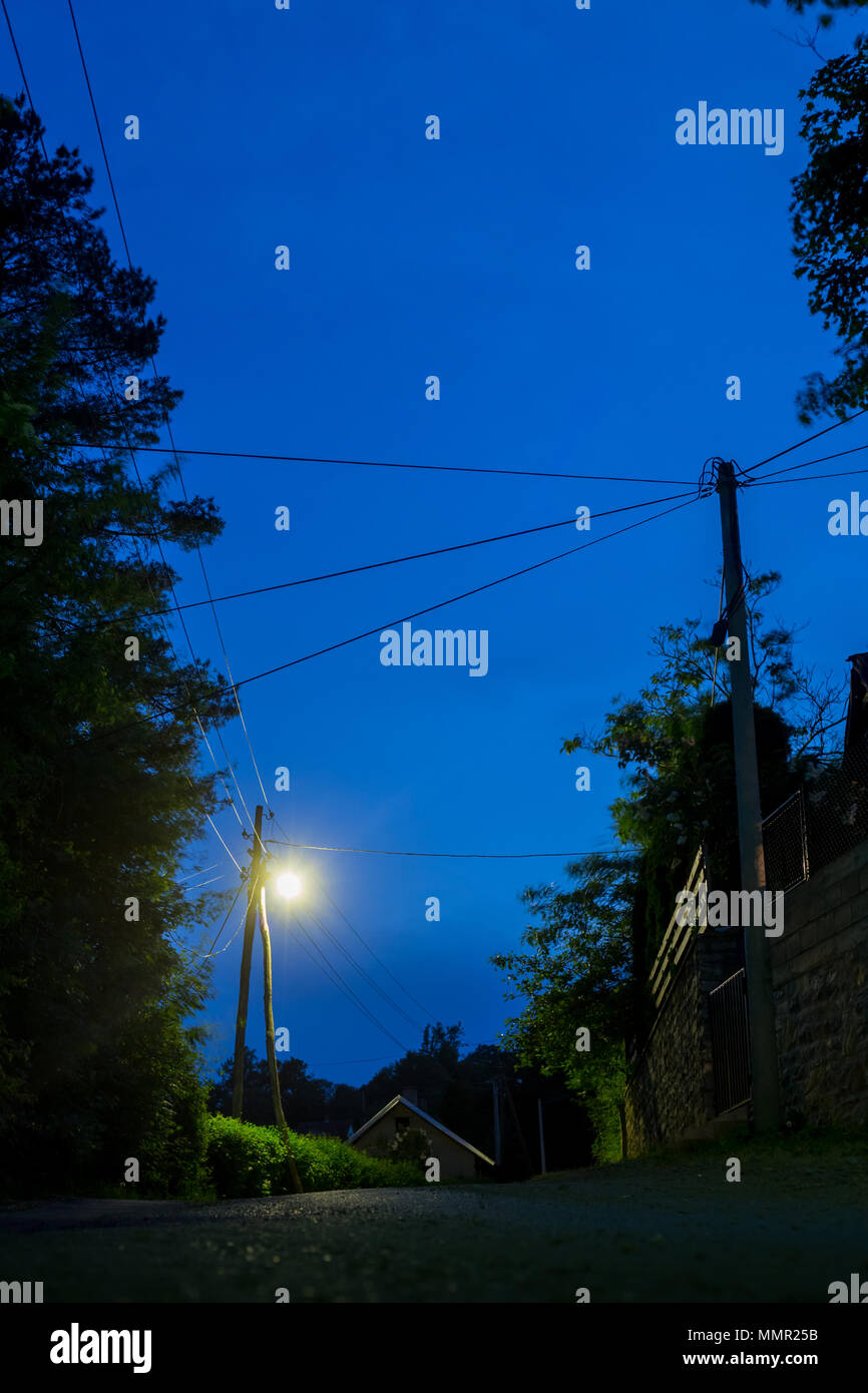 Street lamp on the night scene of village street Stock Photo - Alamy