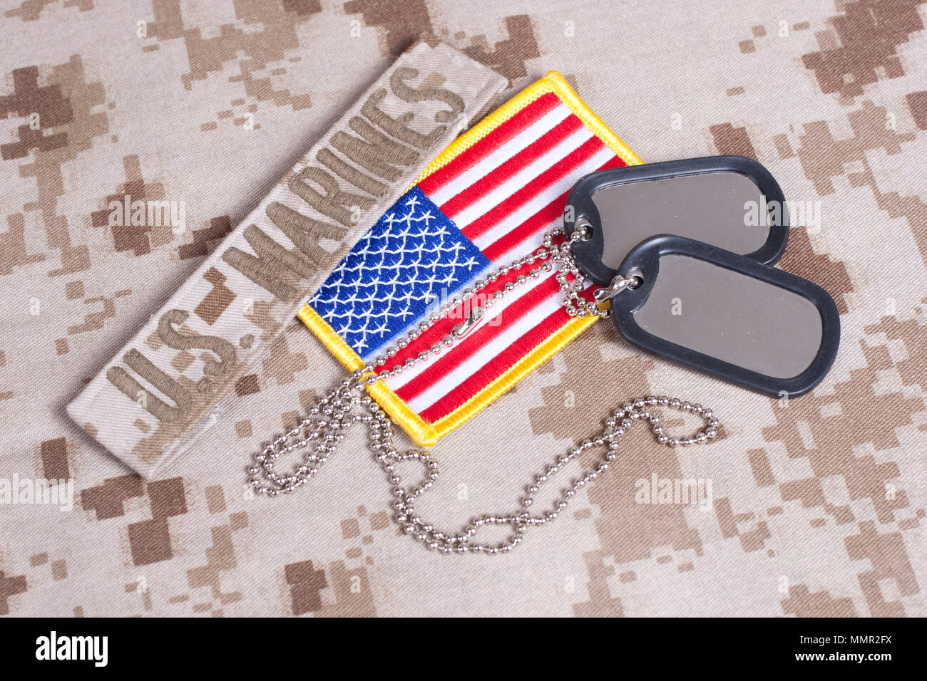 US Marines concept with service tapes, dog tags and camouflaged uniform ...