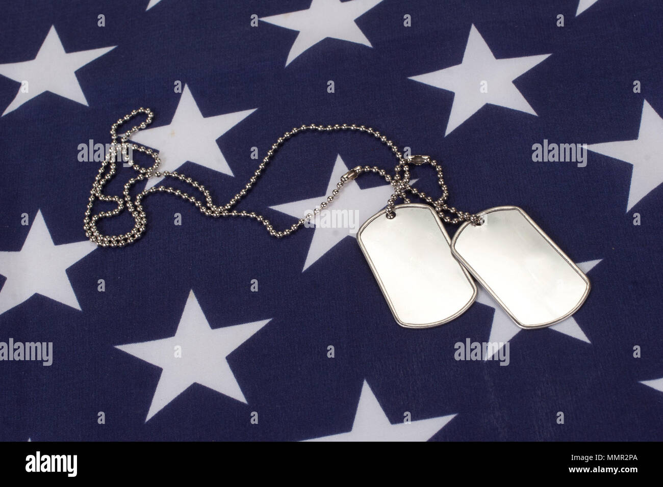 dog tags on american flag Stock Photo - Alamy
