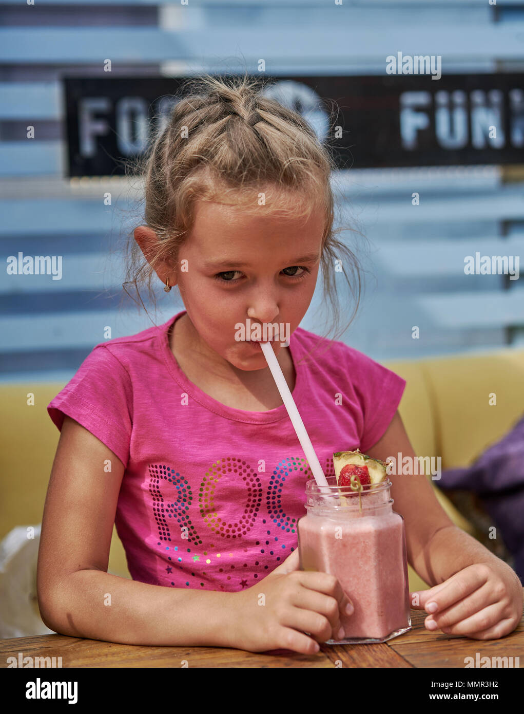 little girl drinking a cocktail in a cafe Stock Photo - Alamy