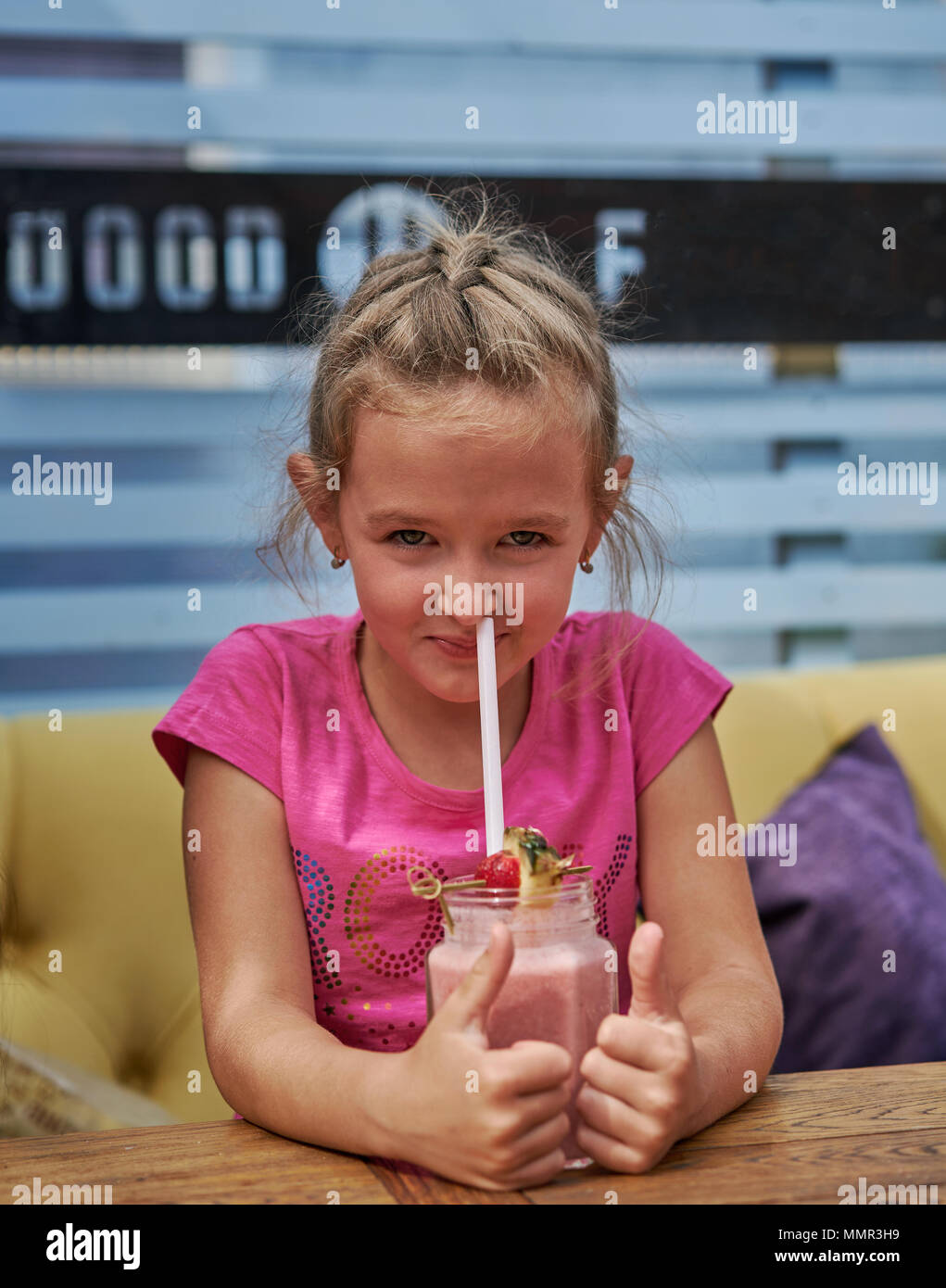 Girl drinking chocolate milkshake hi-res stock photography and images ...