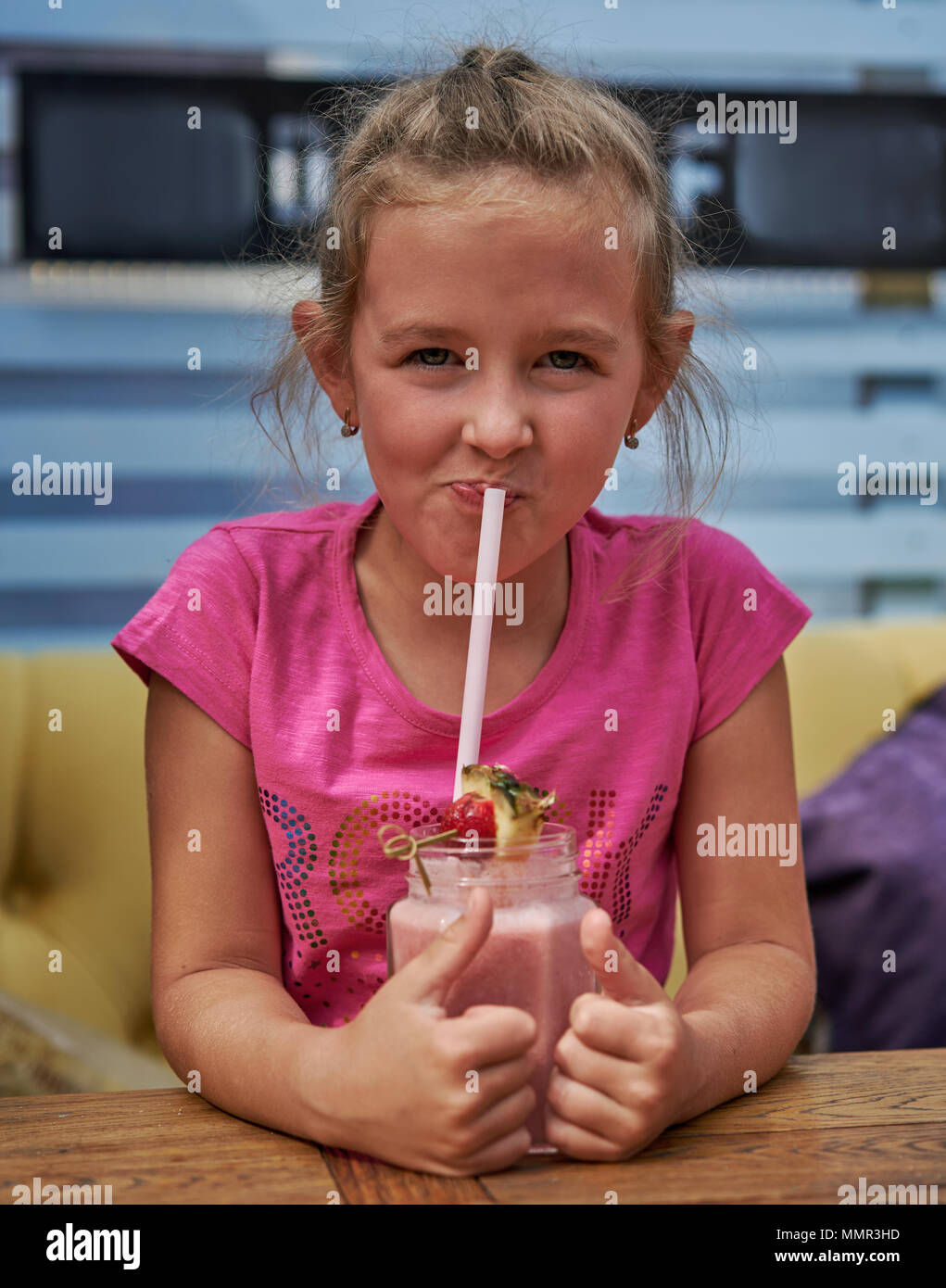 little girl drinking a cocktail in a cafe Stock Photo - Alamy