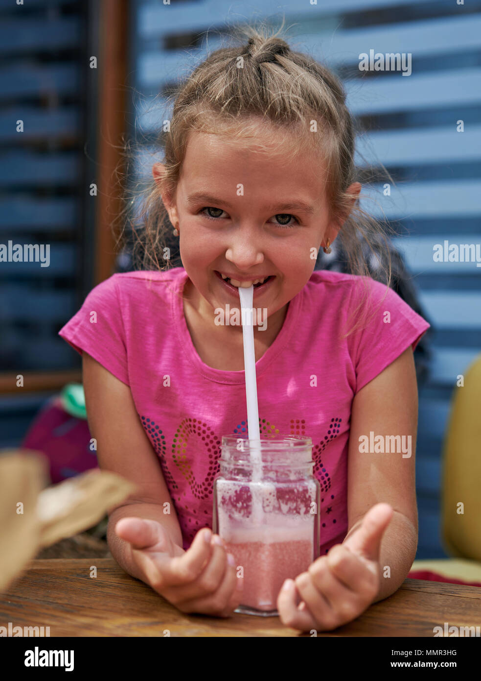 Portrait girl drinking chocolate milkshake hi-res stock photography and ...