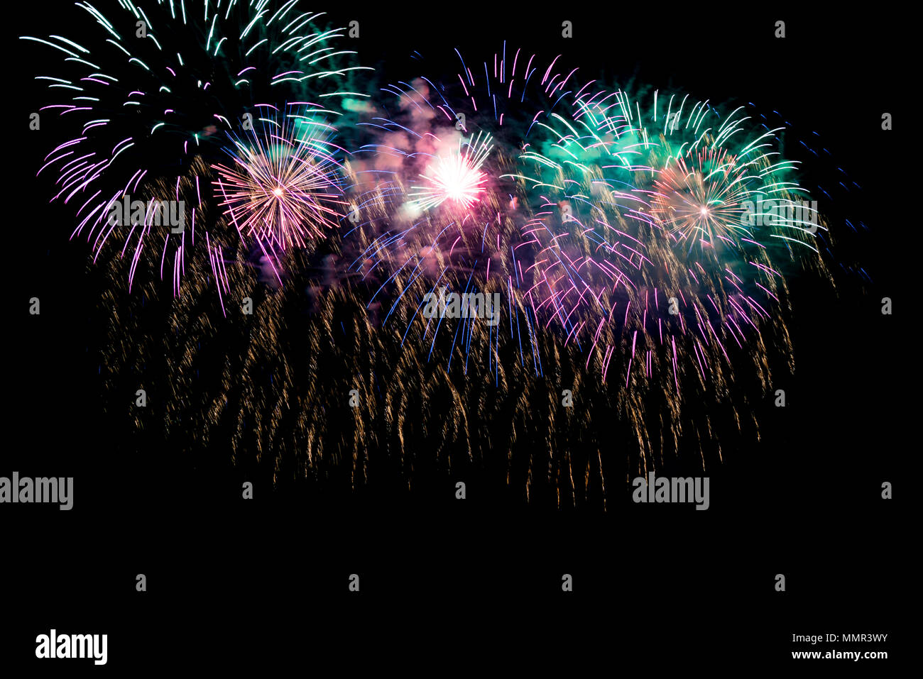 Colorful explosions of festive fireworks in the night sky Stock Photo ...