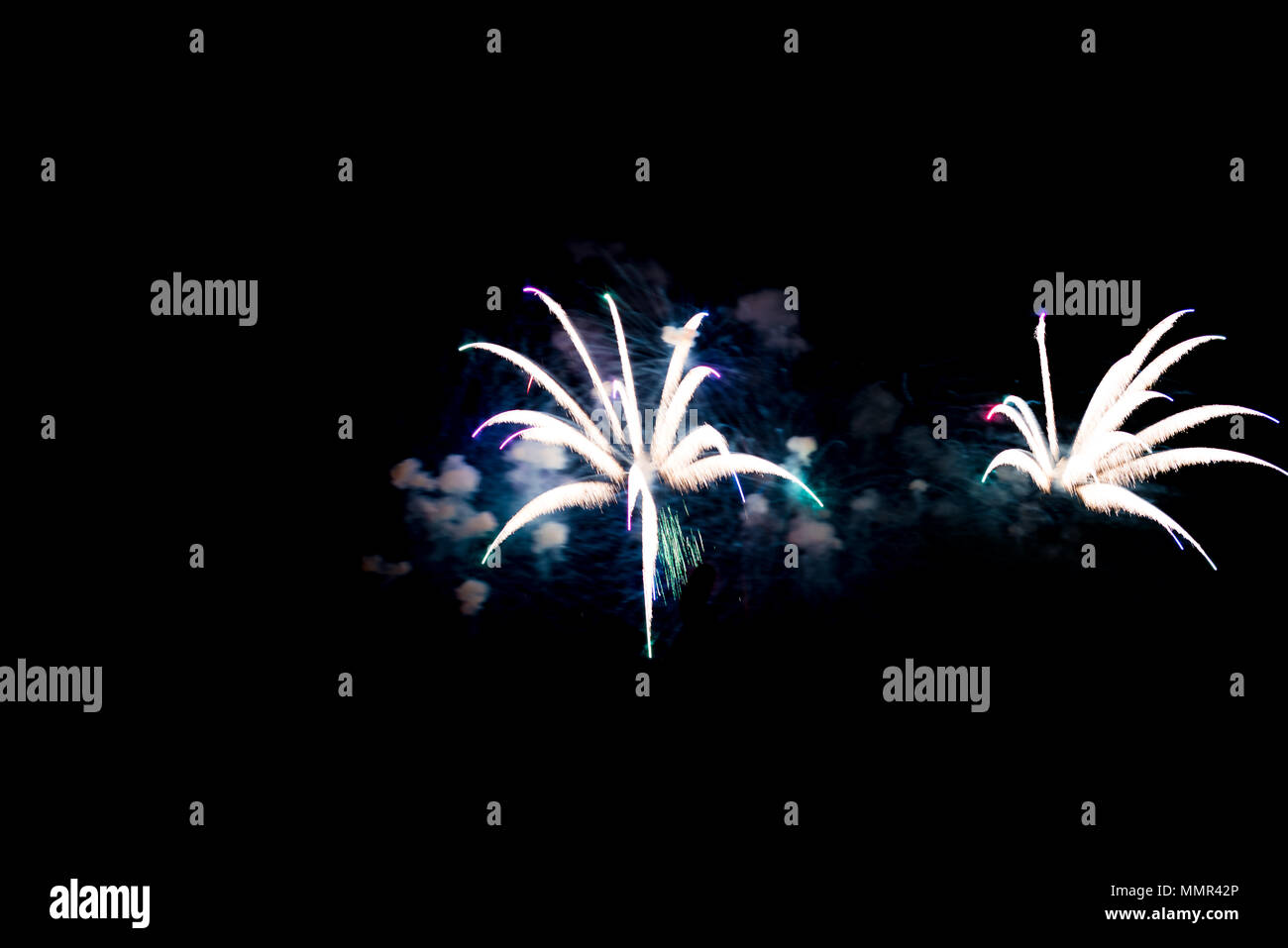 Colorful explosions of festive fireworks in the night sky Stock Photo ...
