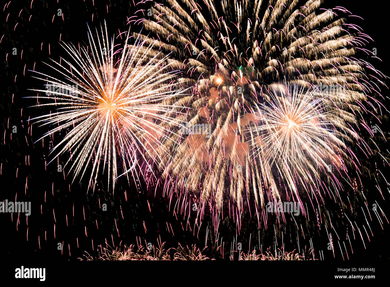 Colorful explosions of festive fireworks in the night sky Stock Photo ...