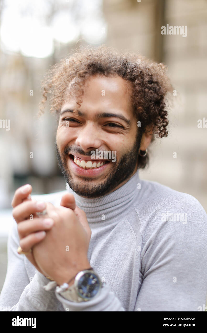 Close up face of smiling half american nigerian boy looking at camera ...
