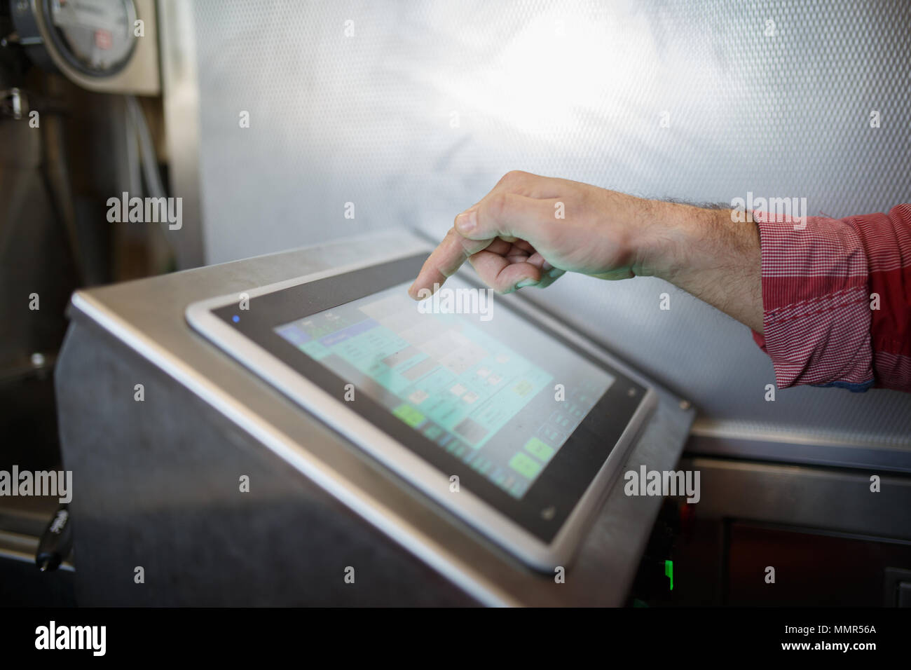 Photo of computer monitor, person's hands in workshop Stock Photo - Alamy