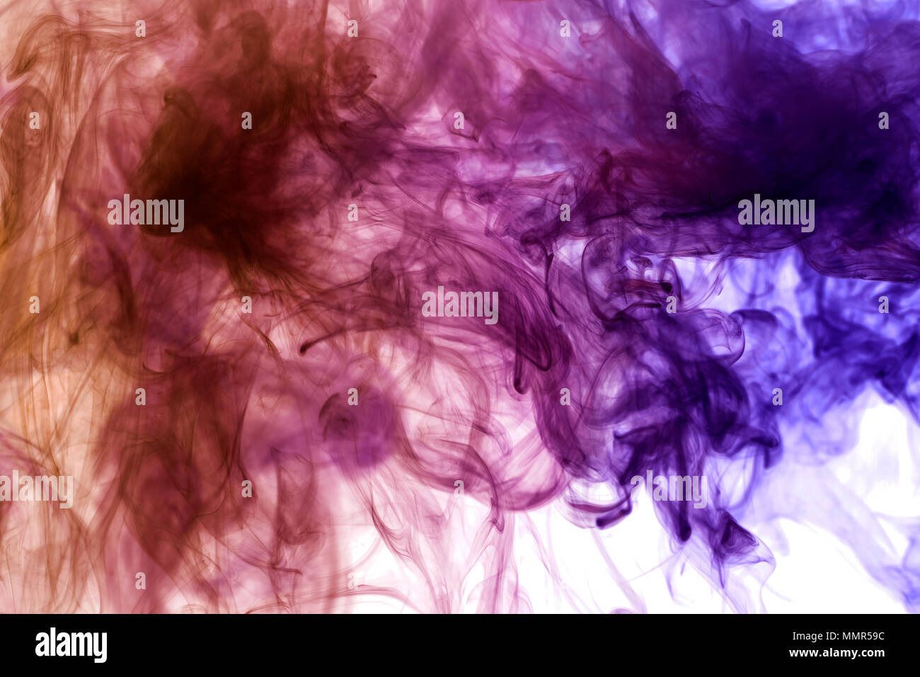 Thick colorful purple,red smoke on a white isolated background ...