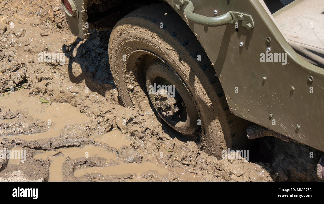 a wheel of military vehicle in the mud Stock Photo - Alamy