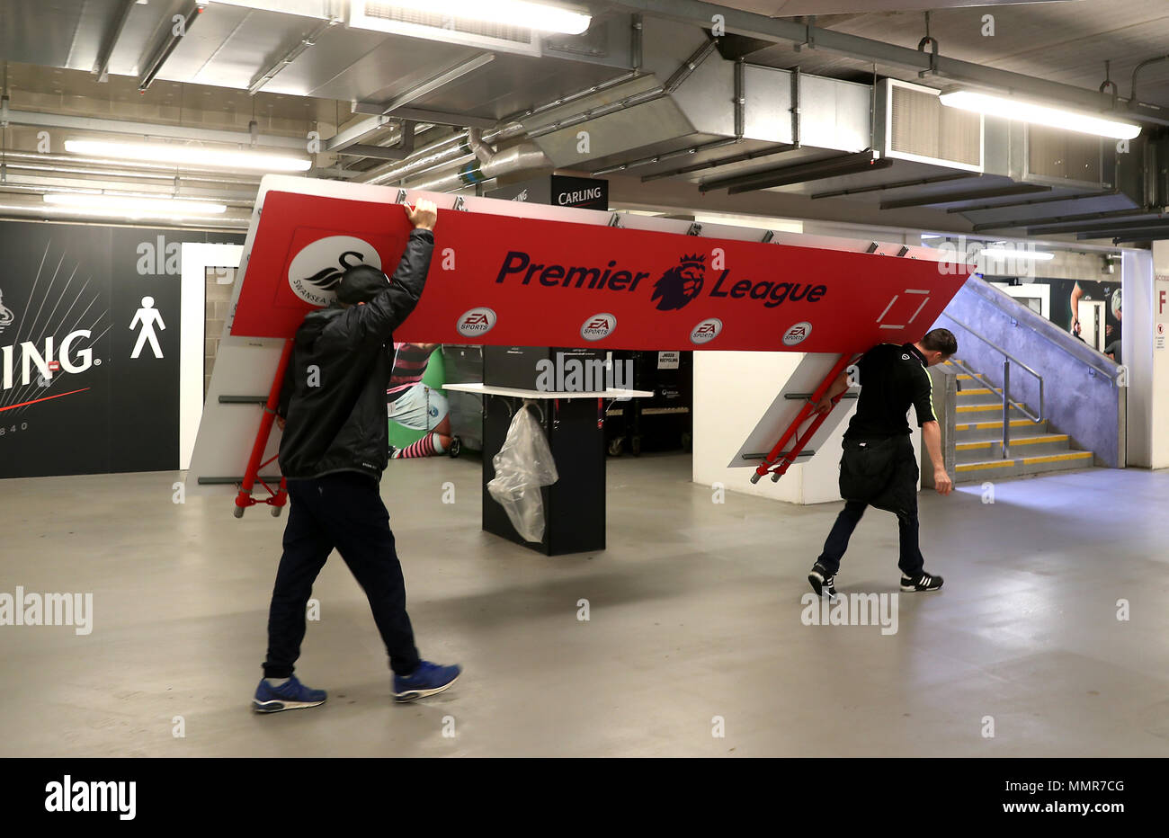 The Premier League sign being carried to the pitch before the game ...