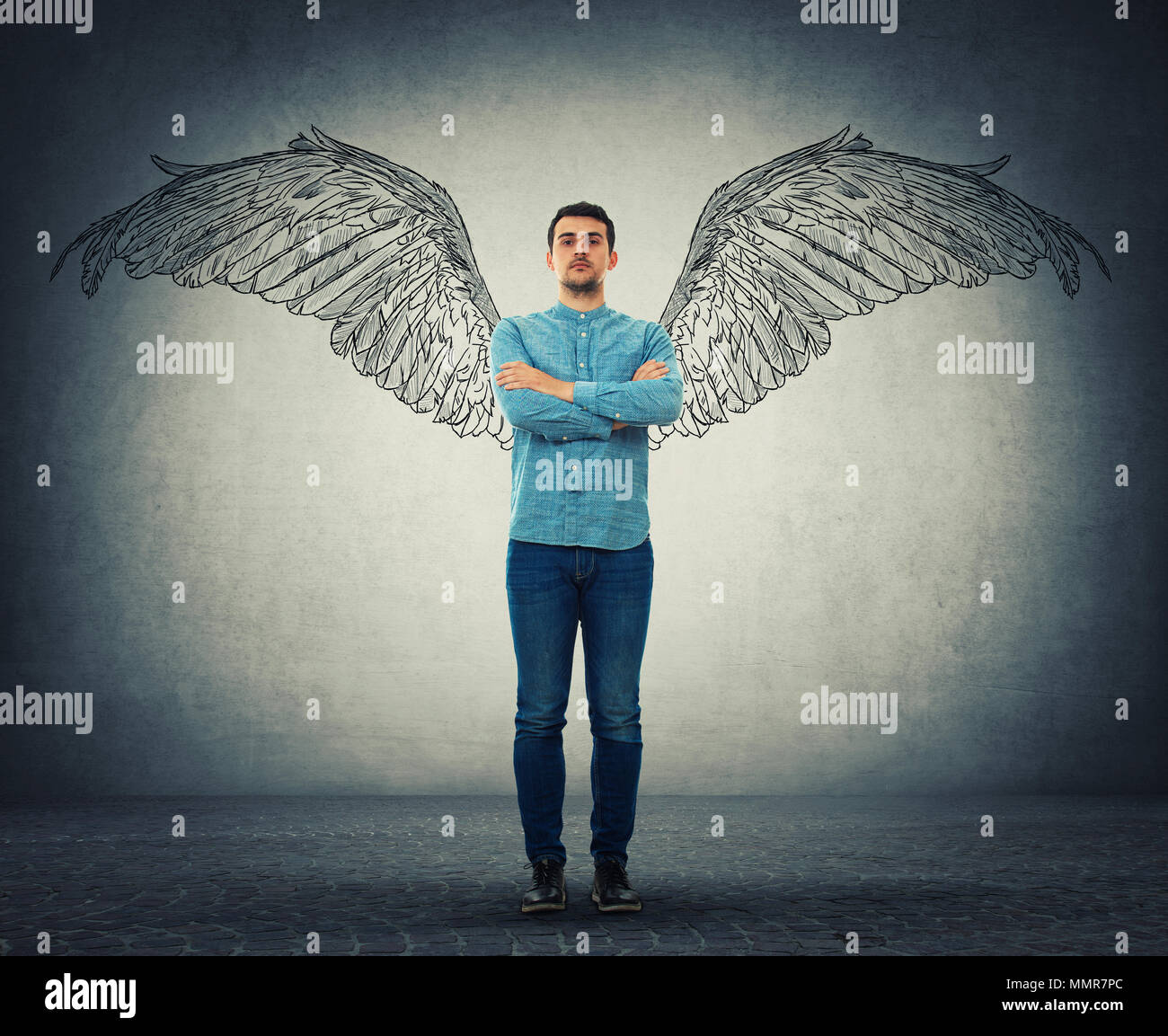 Full length portrait of a serious young man with crossed hands ...