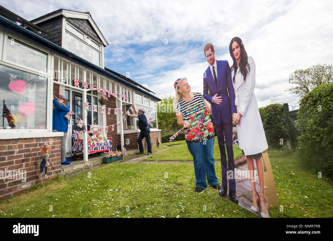Angela and Richard Rooke and their daughter Jessica with their house ...