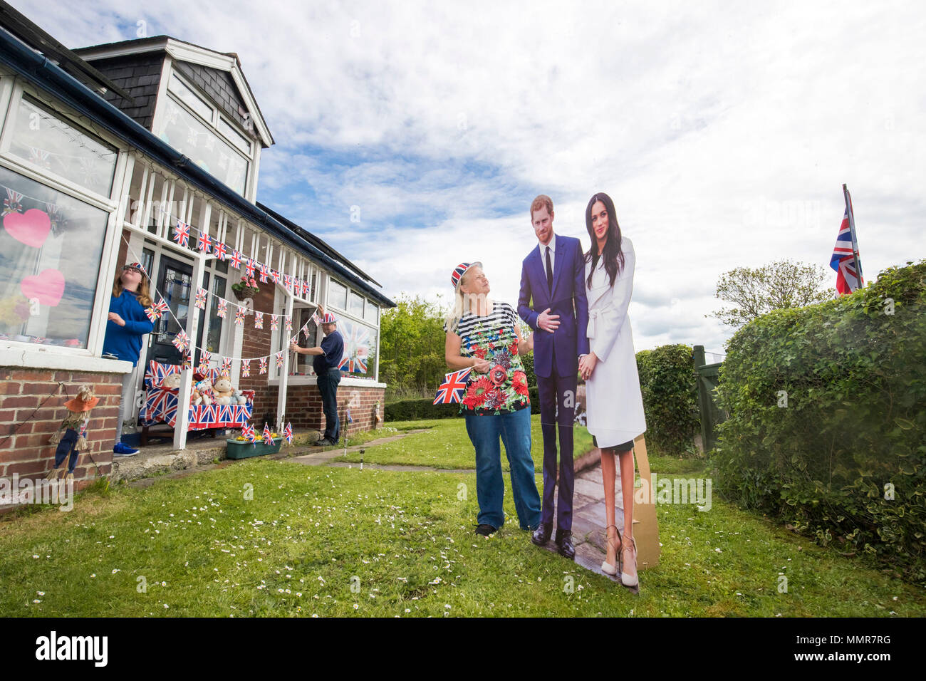 Angela and Richard Rooke and their daughter Jessica with their house ...